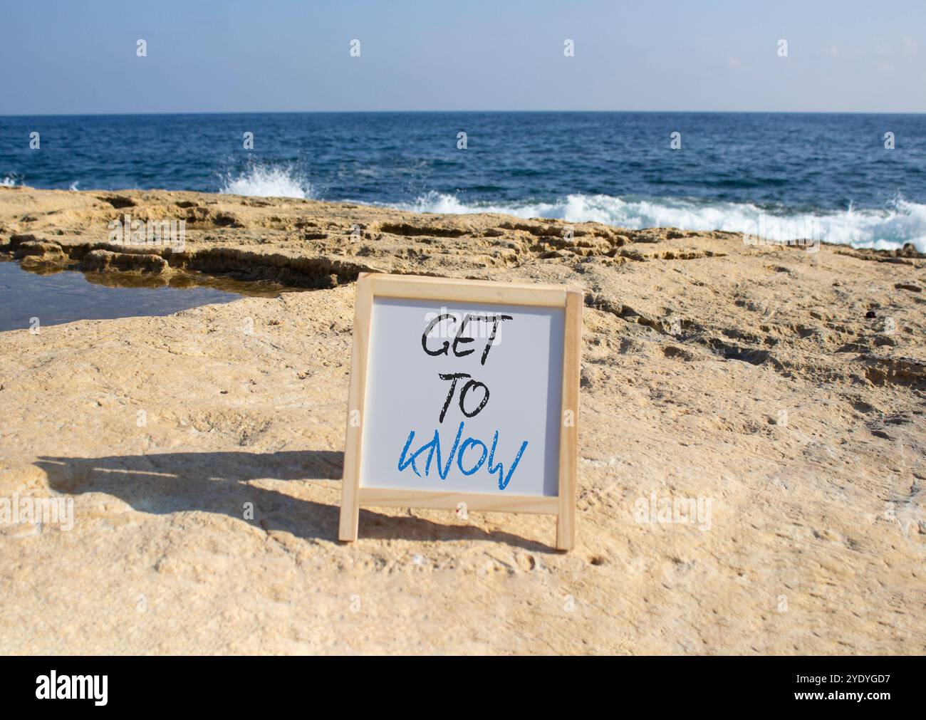 Get to Know symbol. White Blackboard with words Get to Know. Beautiful ...