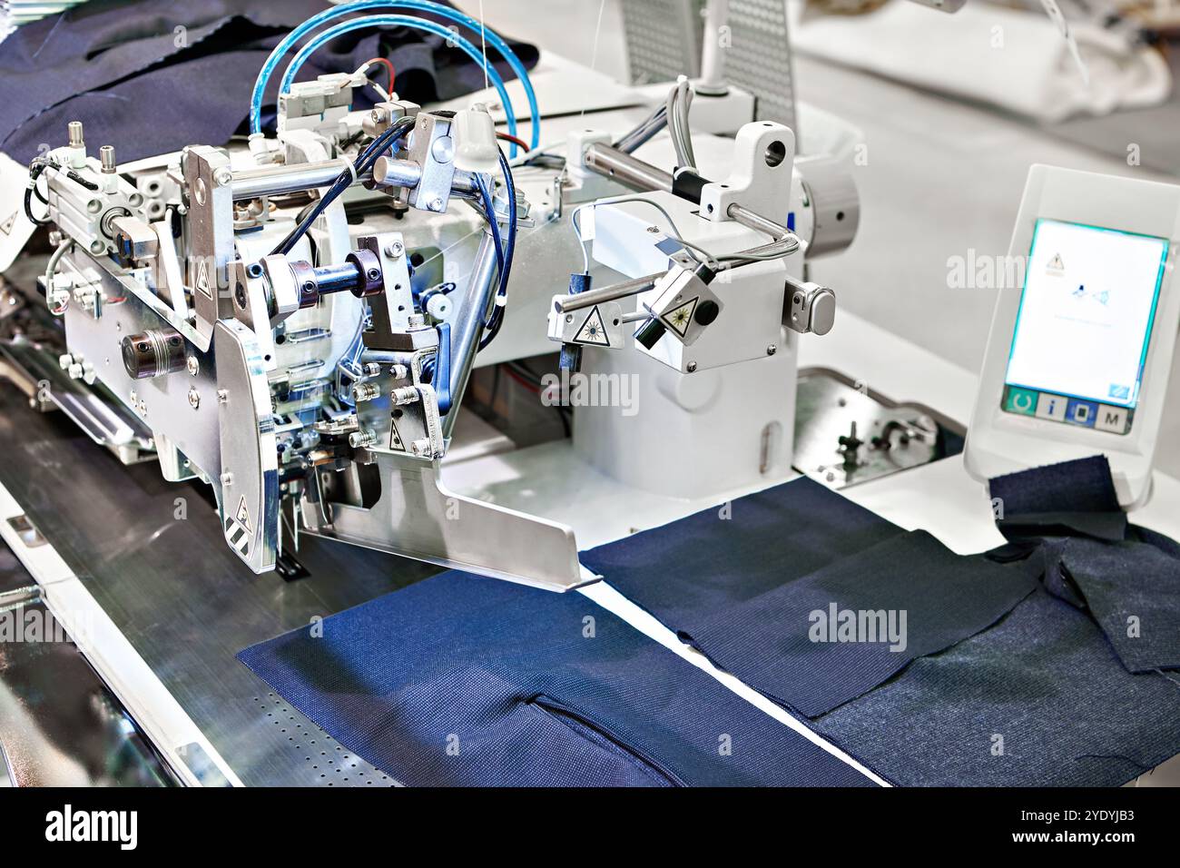 Automatic slit pocket in frame making sewing machine Stock Photo - Alamy