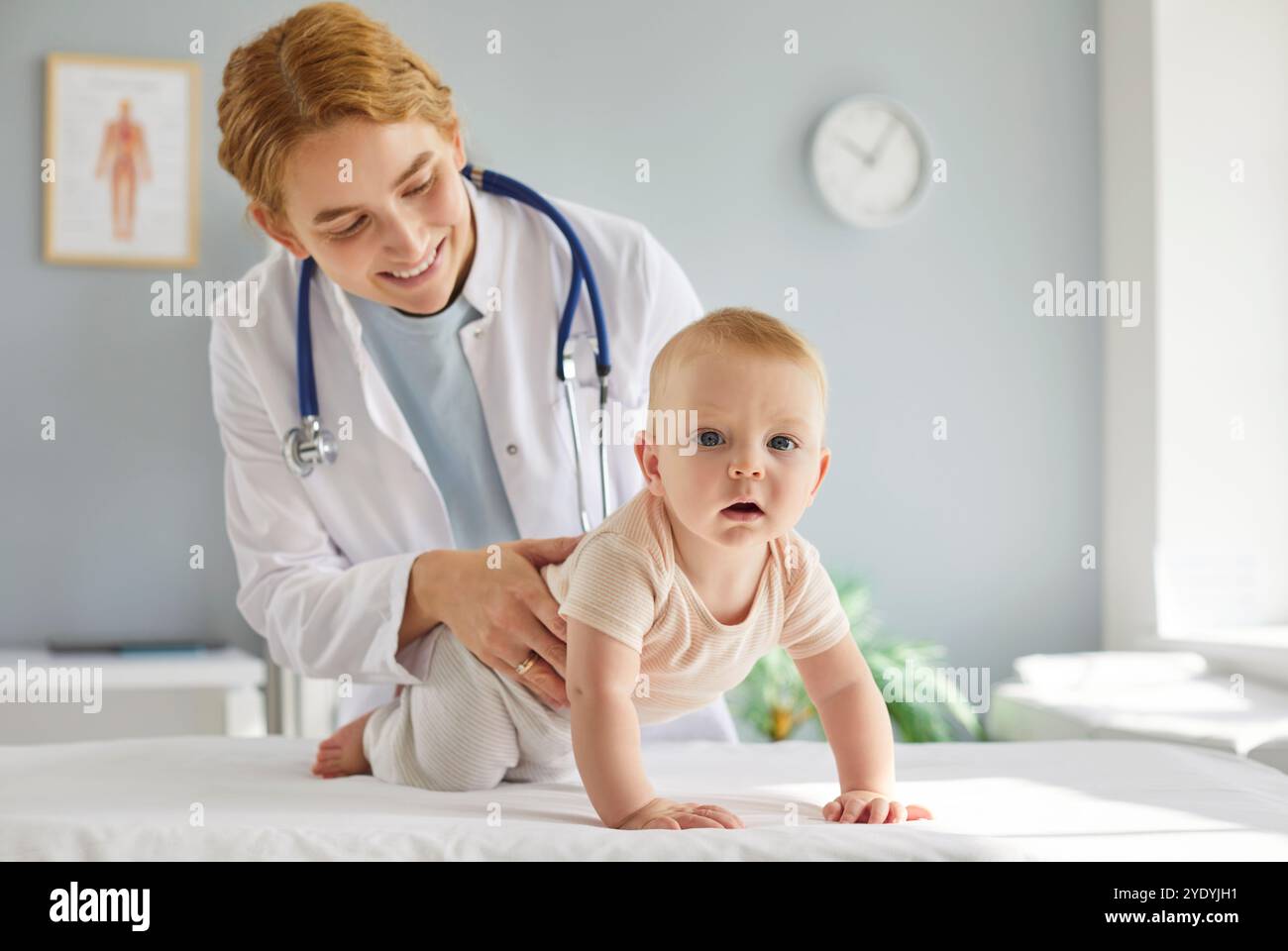 Pediatrician Doctor Examining A Baby During A Clinic Visit Stock Photo ...
