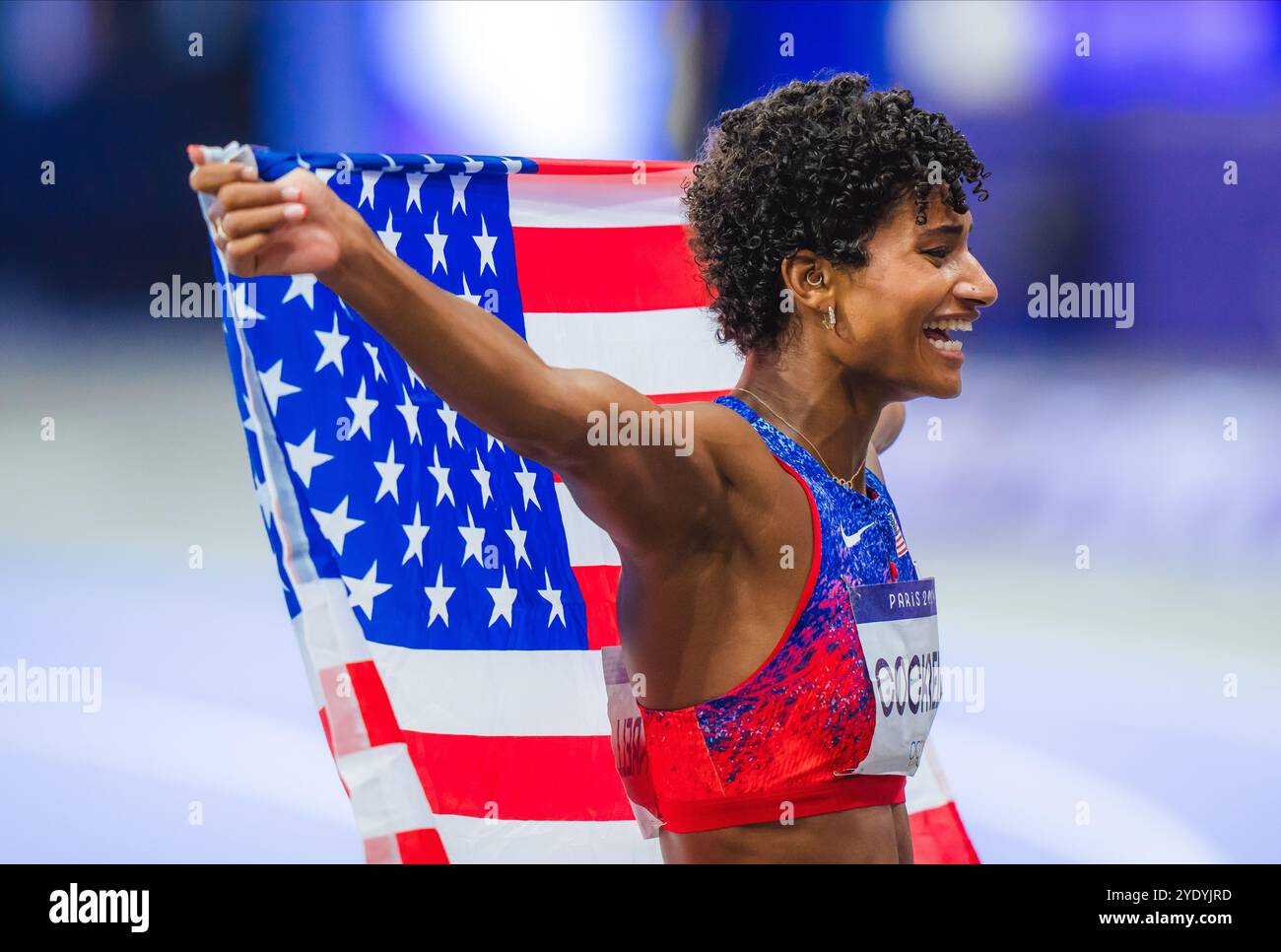 Anna Cockrell celebrating with her country's flag in the 400 meters ...