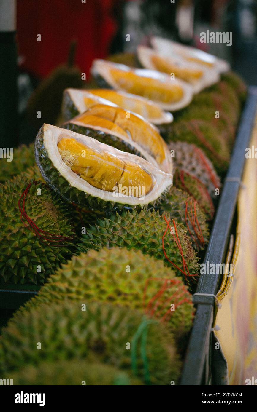 Display of durian fruit at the local market. Some of the durian fruits ...