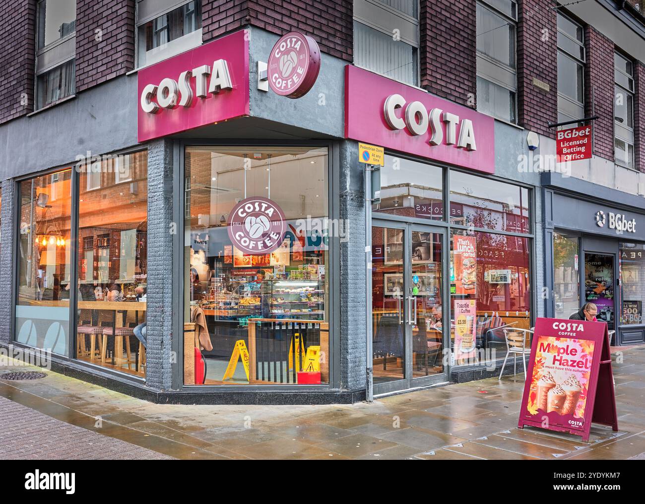 Costa coffee shop in the town centre at Kettering, England, on a wet ...