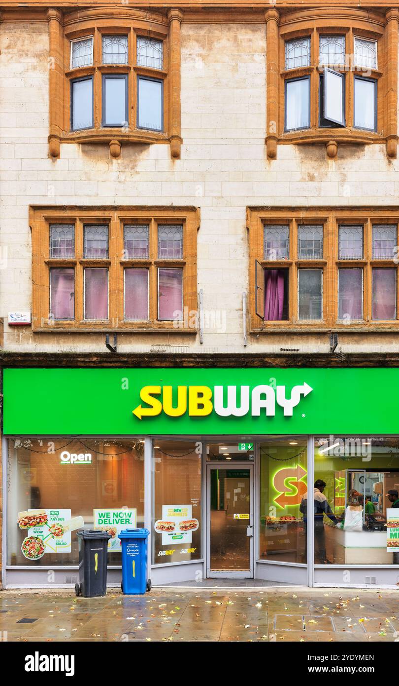 Subway food shop in the town centre at Kettering, England, on a wet day ...