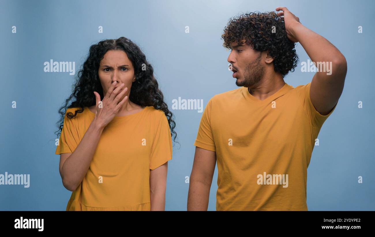 Multiracial shocked scared afraid couple amazed shocked Hispanic woman ...