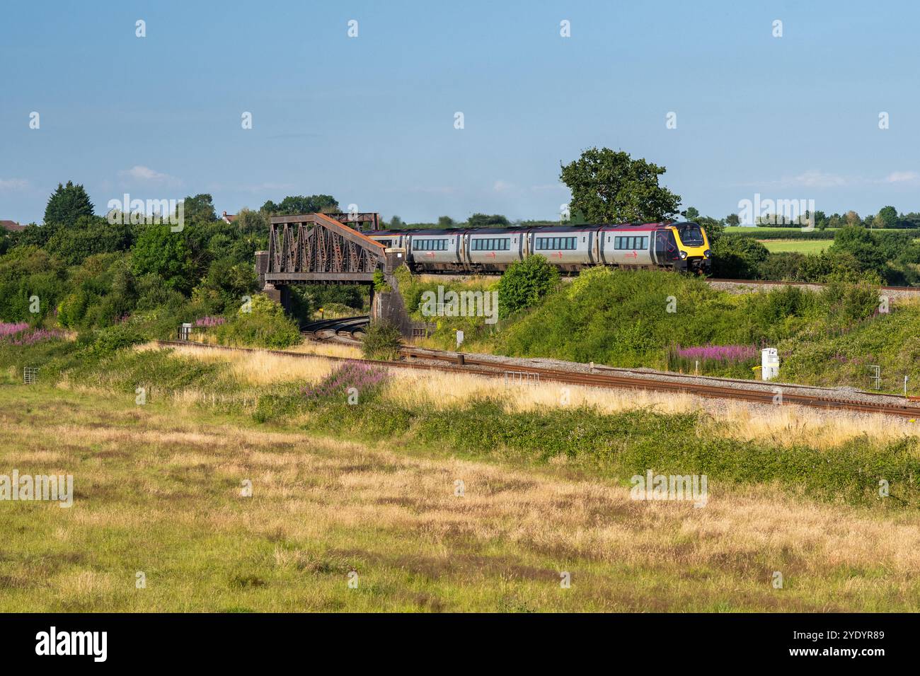 A CrossCountry Voyager passenger train crosses the Reading-Taunton Line ...