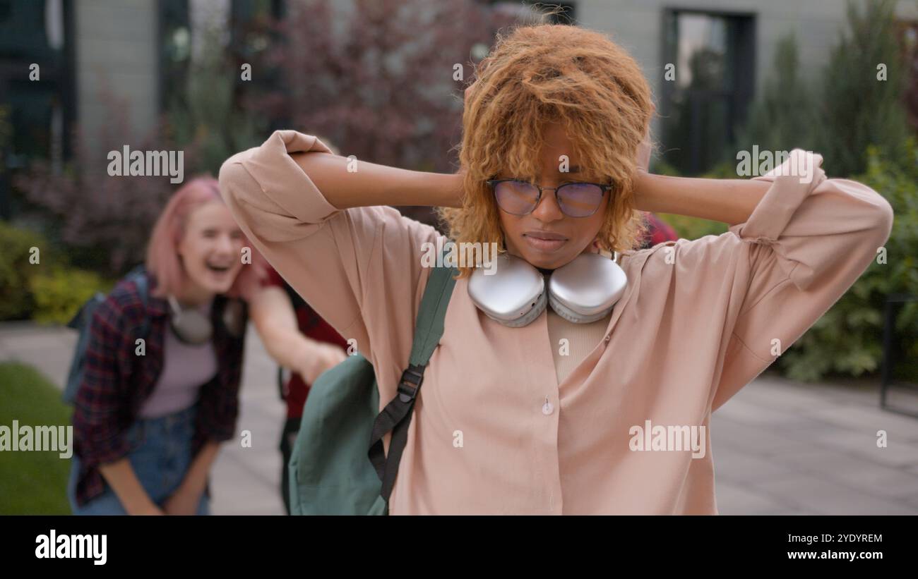 Group of angry students teenagers multiracial classmates mock humiliate ...