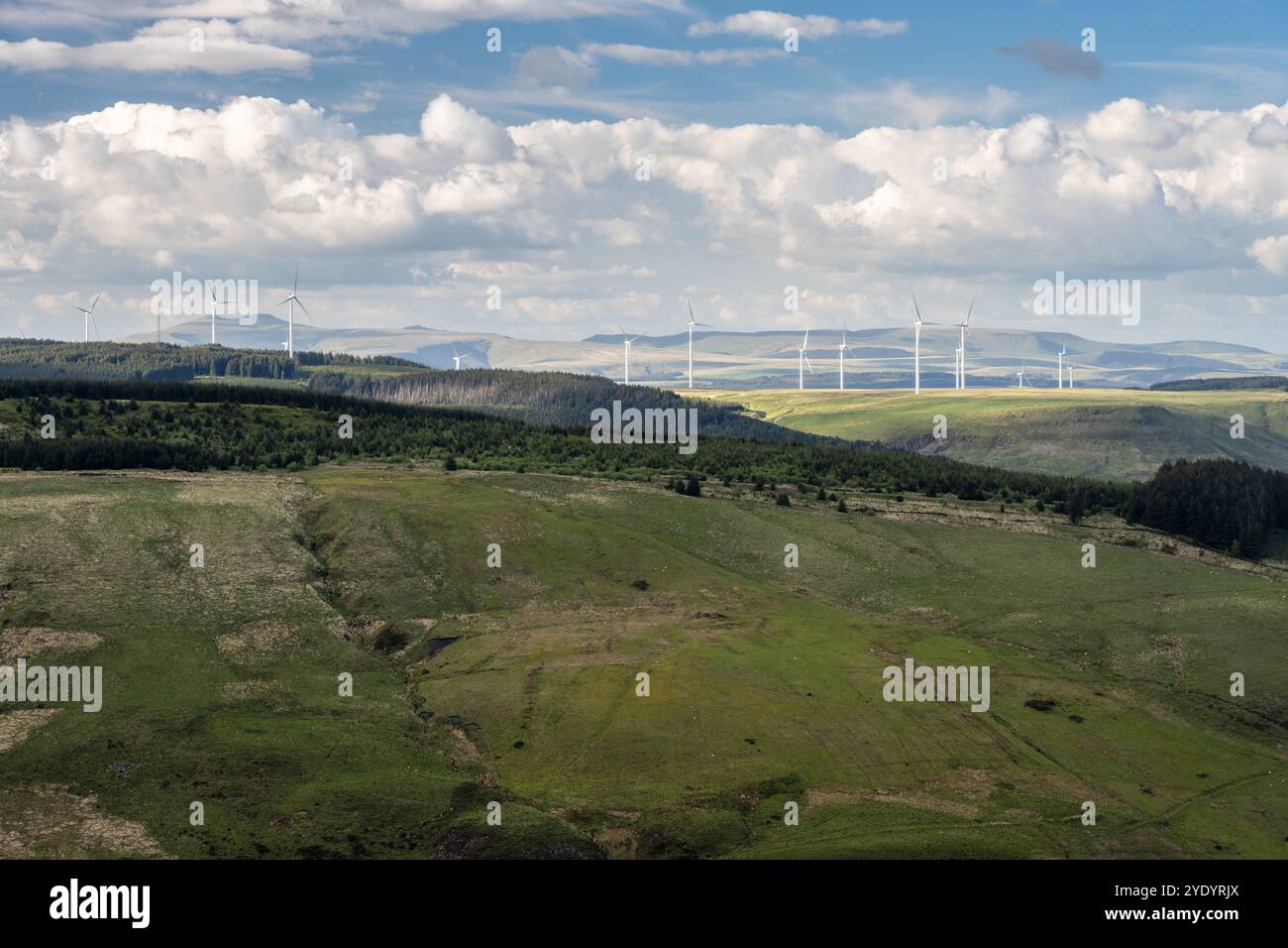 The Brecon Beacons mountains rise behind the turbines of Maerdy Wind ...