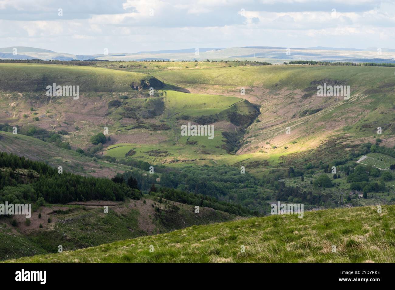 Old quarry workings and spoil heaps scar a hillside above Treorchy in ...