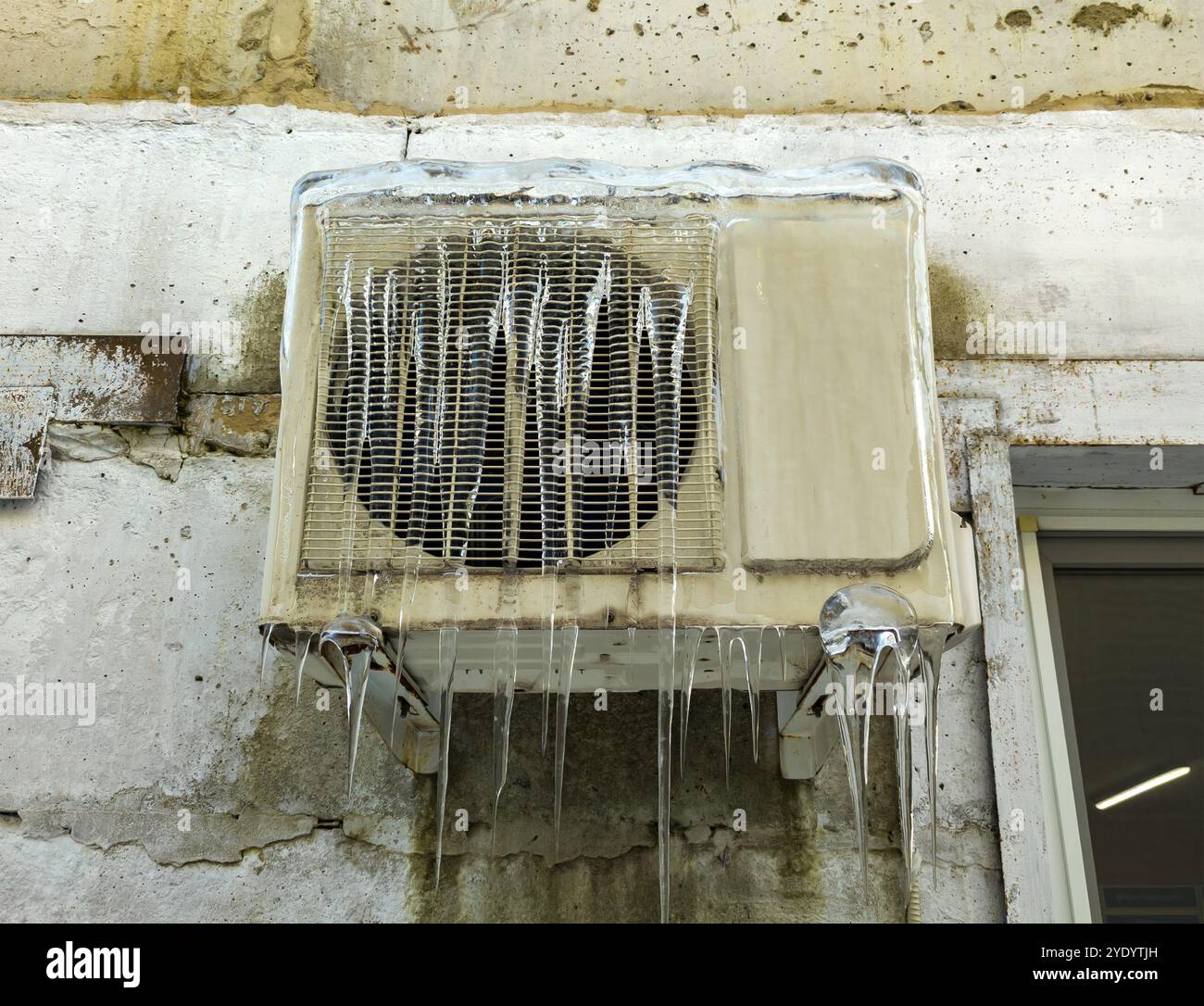 Frozen and ice-covered air conditioner Stock Photo - Alamy