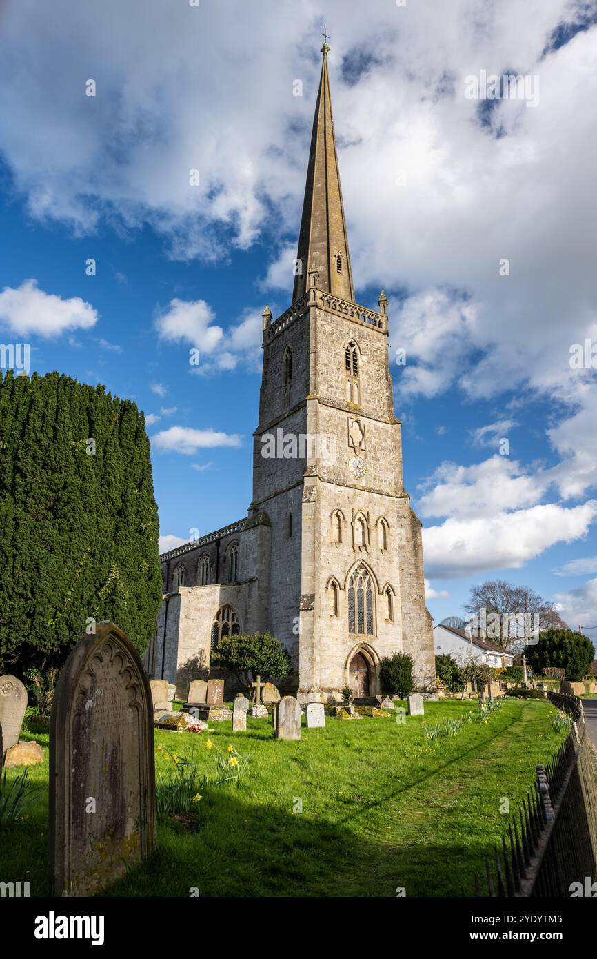 Sun shines on the tower and spire of St John the Evangelist Church in ...
