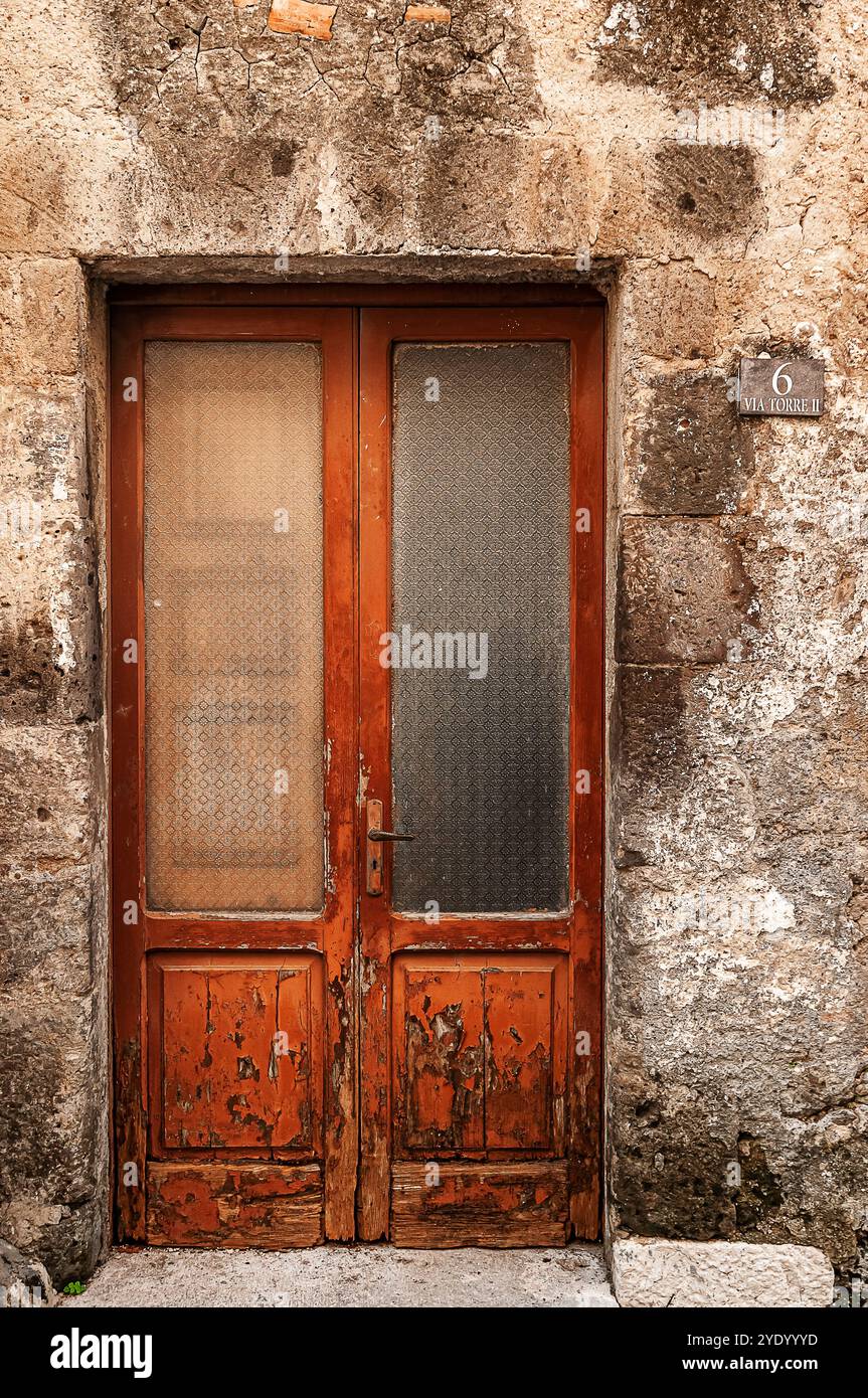an old wooden entrance door at number 16 Stock Photo - Alamy