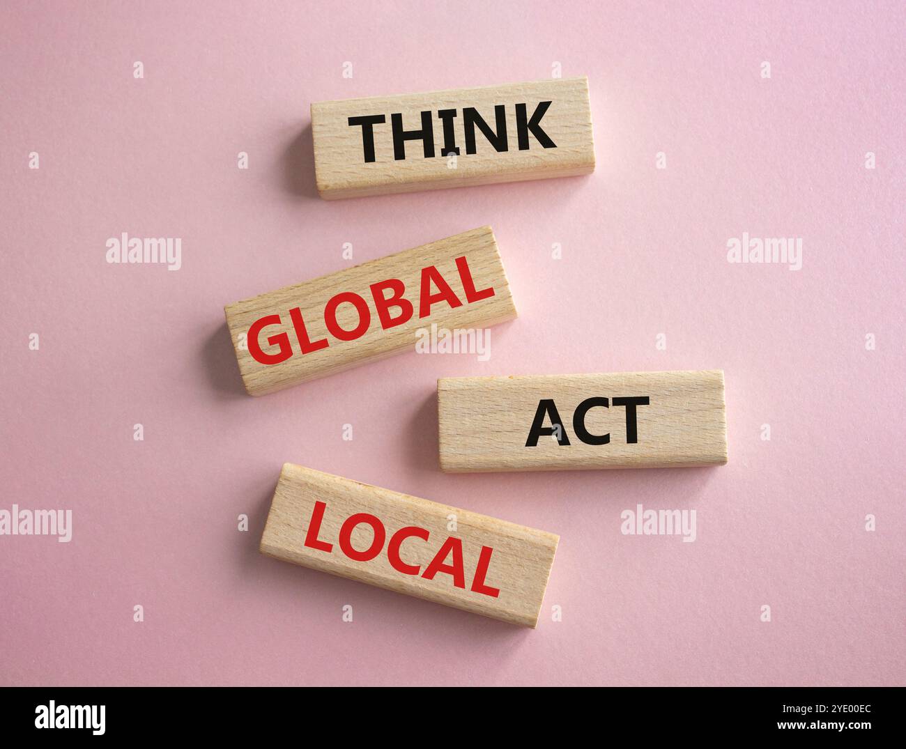 Think global act local symbol. Wooden blocks with words Think global ...