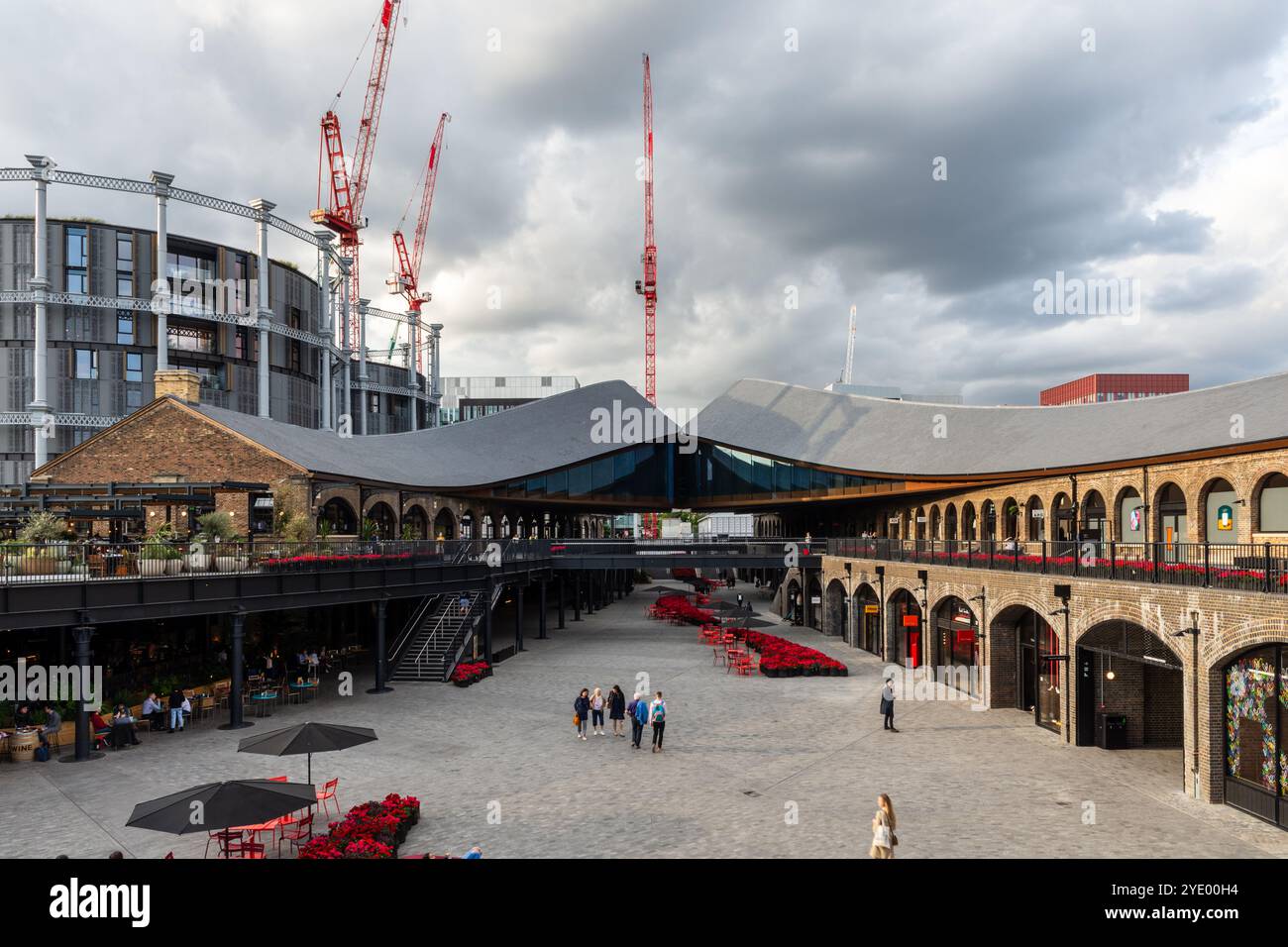 Shoppers walk through Coal Drops Yard, a shopping centre using ...