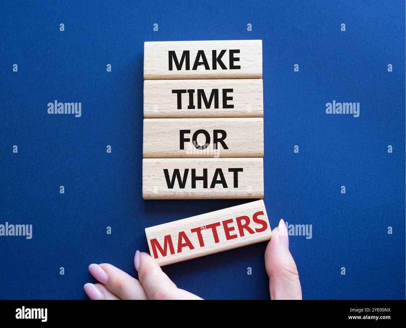 Important thing symbol. Wooden blocks with words Make time for what ...
