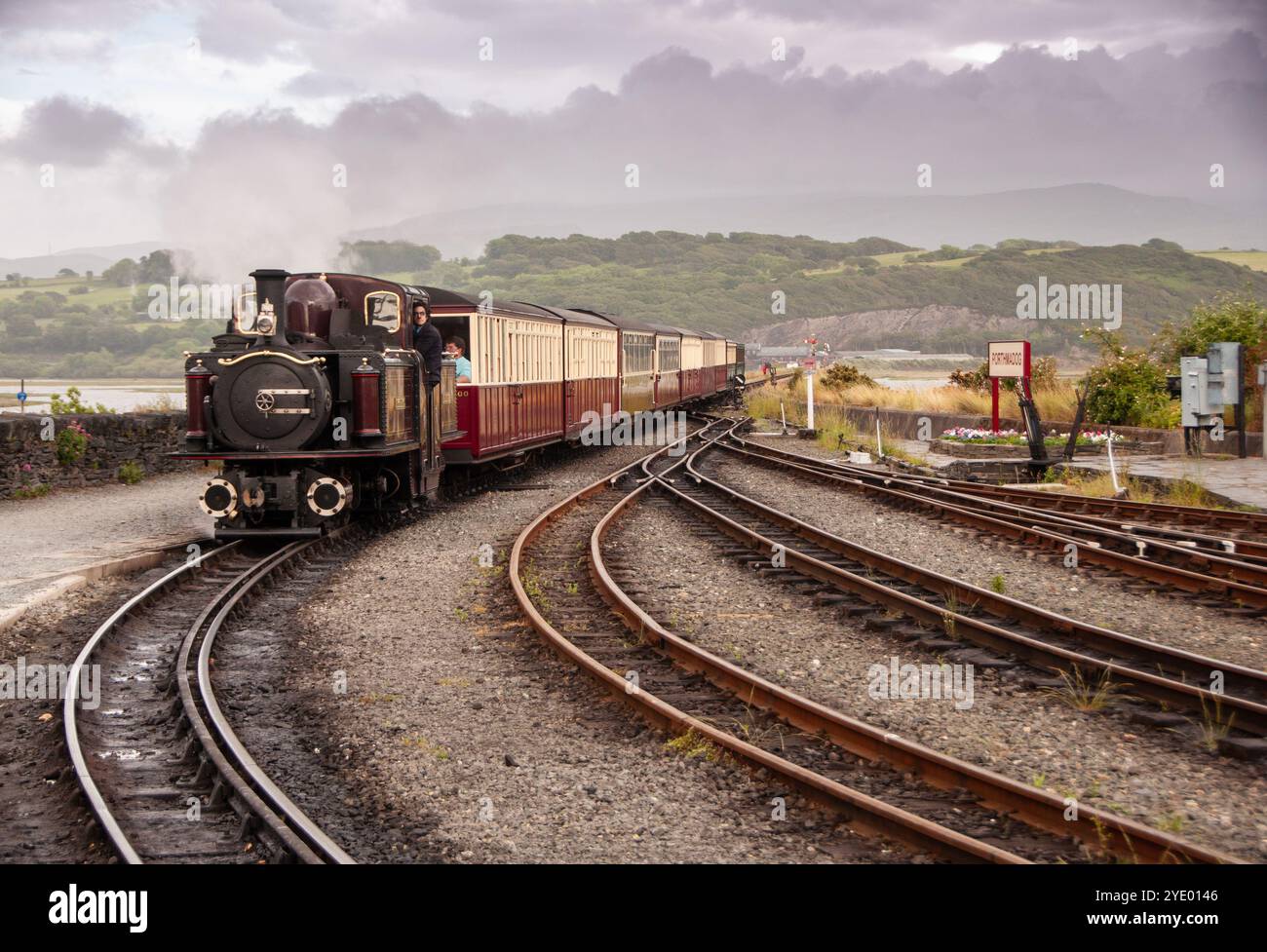A steam train travels along the narrow gauge Ffestiniog Railway, built ...