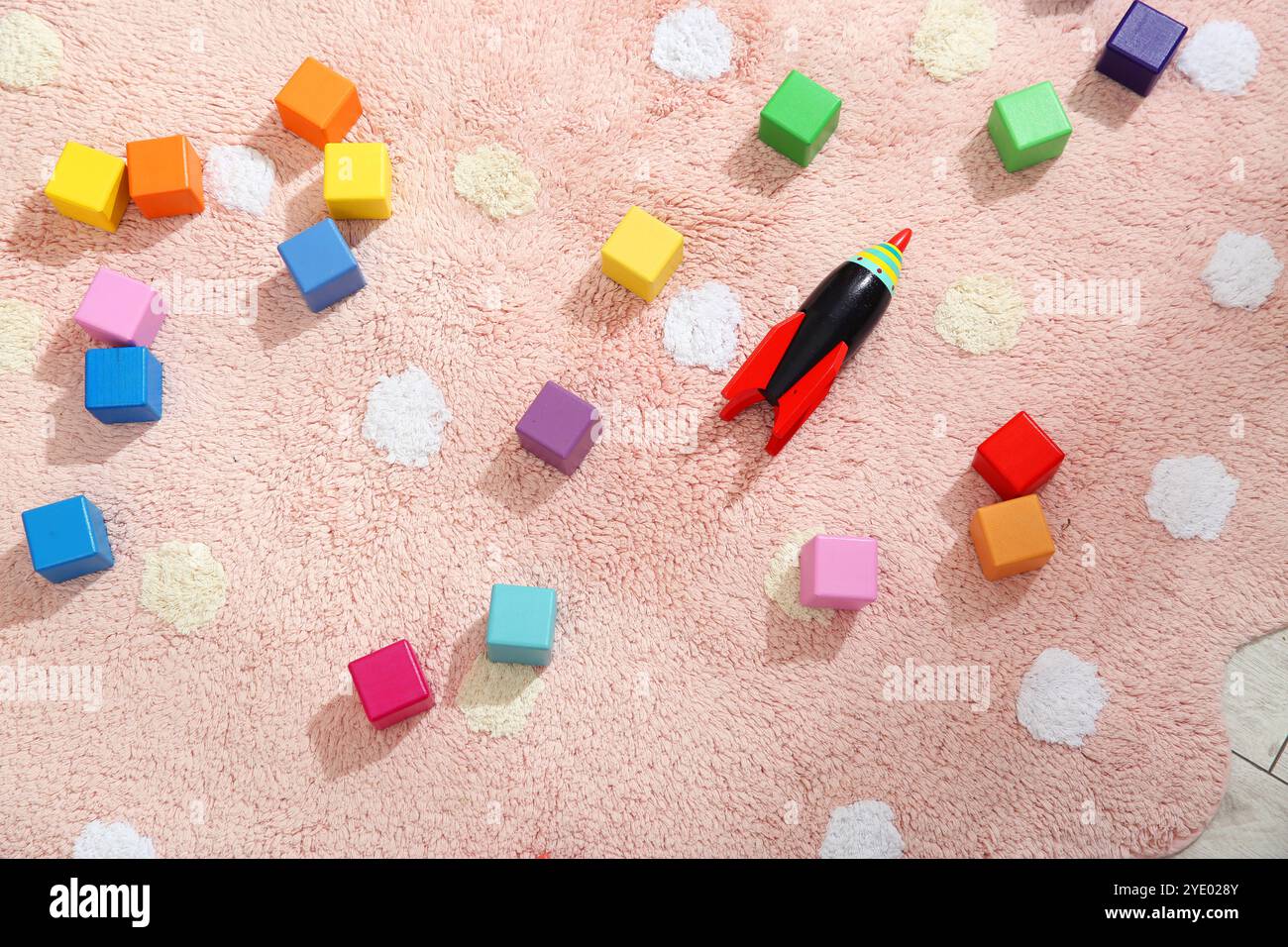 Colorful cubes and rocket toy in child's room, top view Stock Photo - Alamy