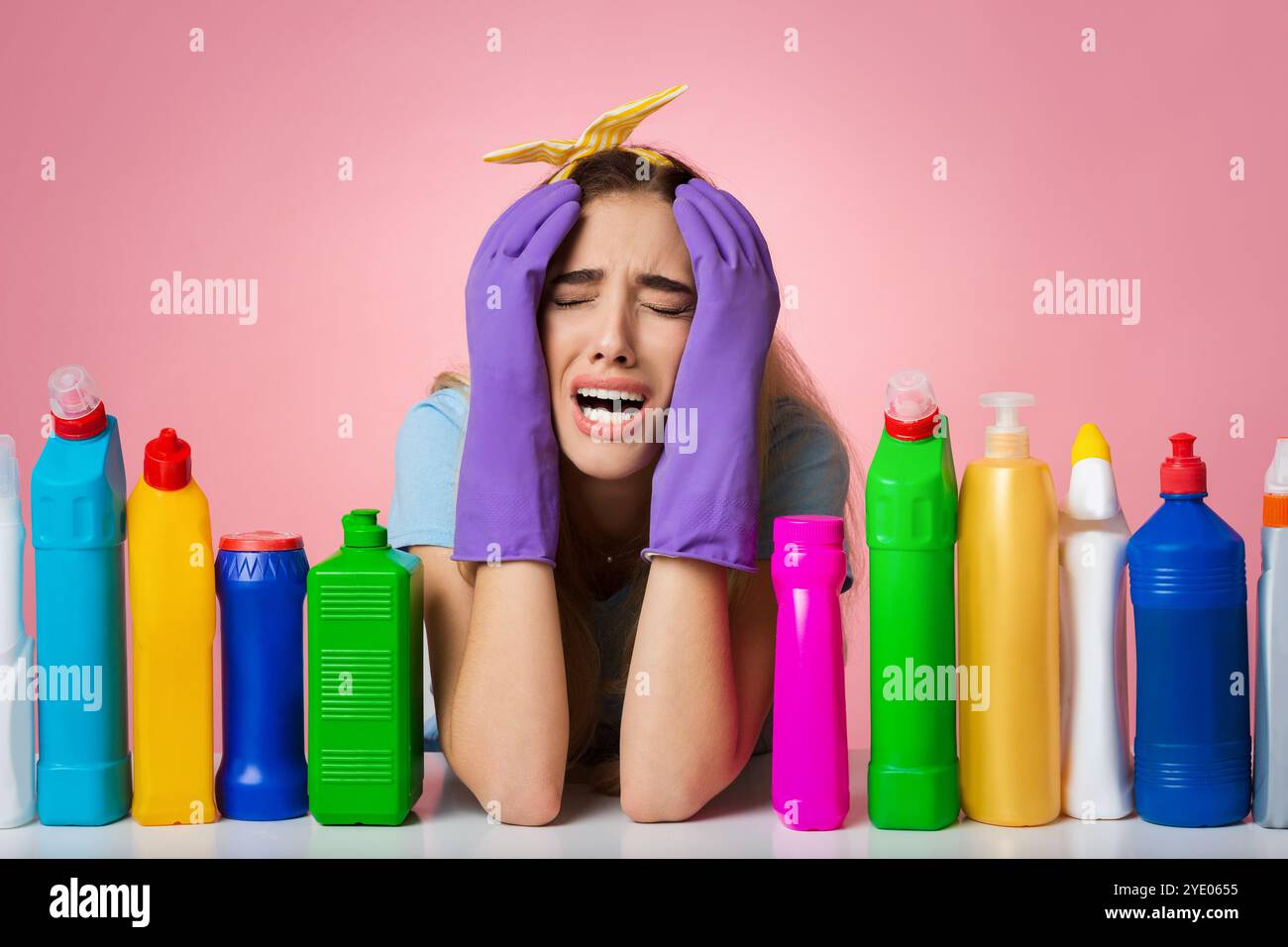Young housewife crying by cleaning, near cleaning supplies Stock Photo ...