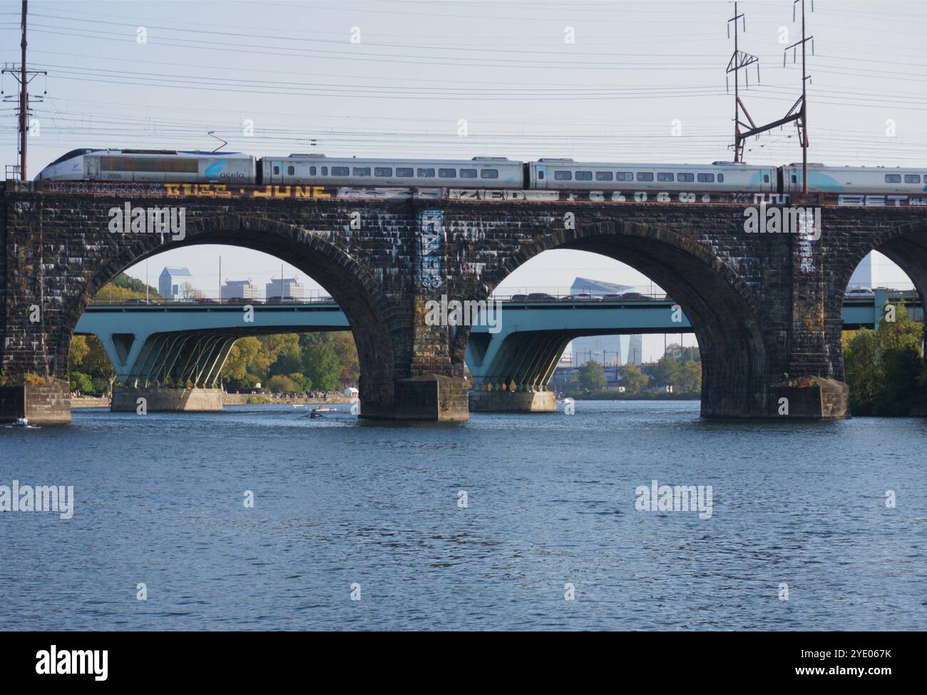 An Amtrak Acela train passes over the Schuylkill River on the ...