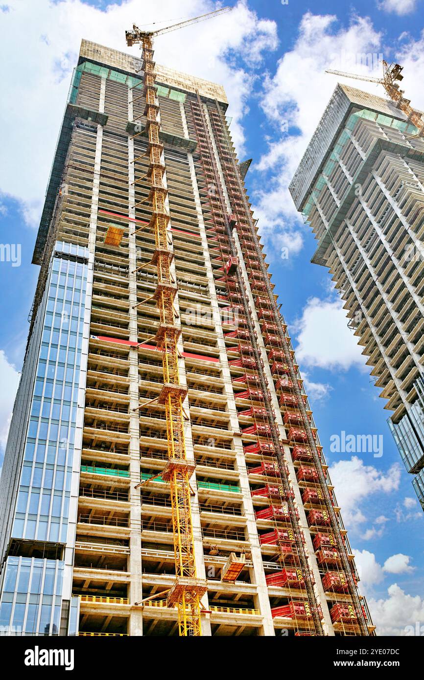 Skyscraper Building under construction in summer day Stock Photo - Alamy