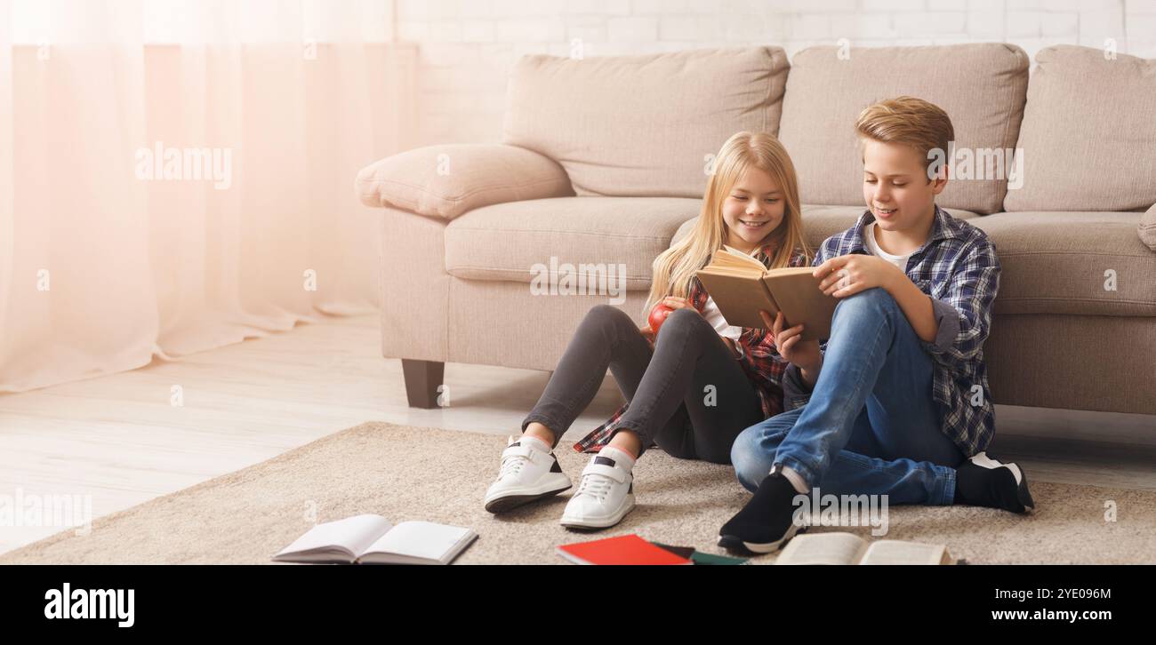 Two cute siblings reading hi-res stock photography and images - Alamy
