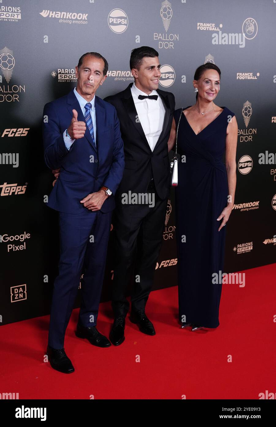 Manchester City and Spain player Rodri with his parents on the red carpet ahead of the Ballon d ...