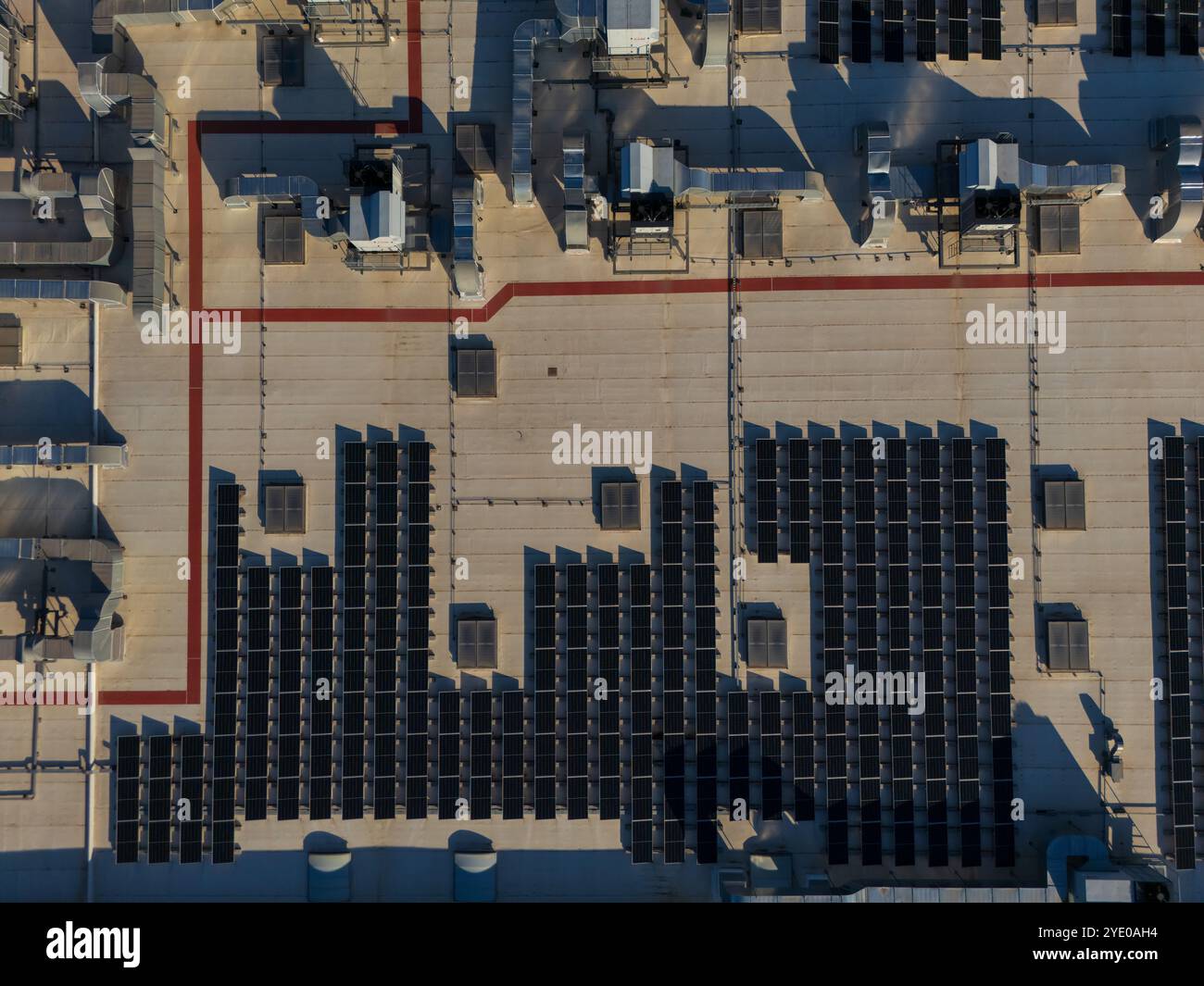 Solar panels on top of a shopping center store Stock Photo - Alamy
