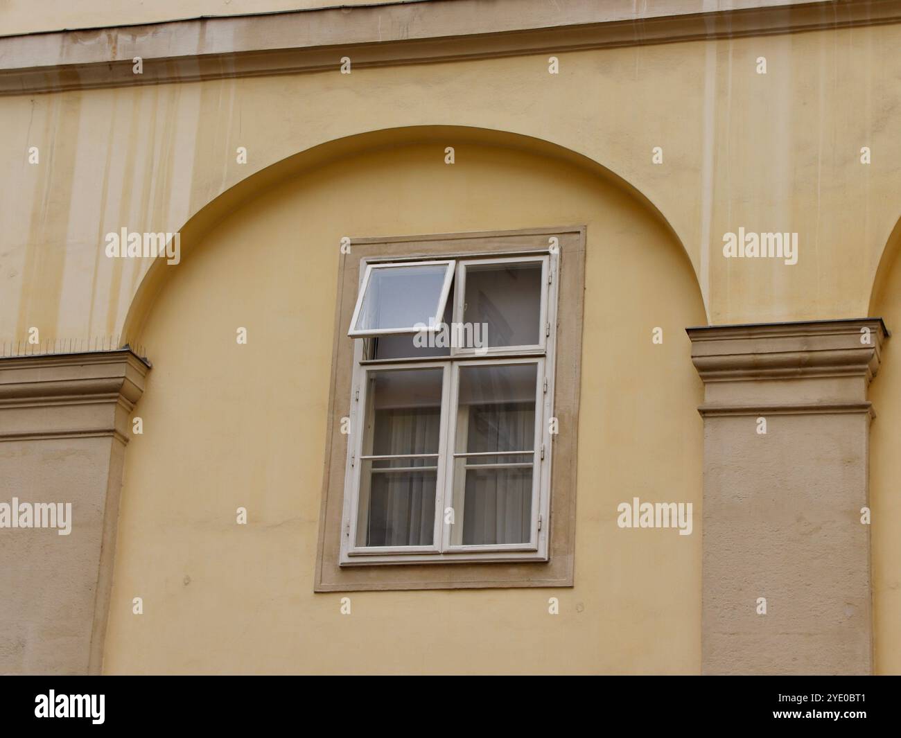Yellow Stucco Wall with Classic European Architecture Featuring an Open ...