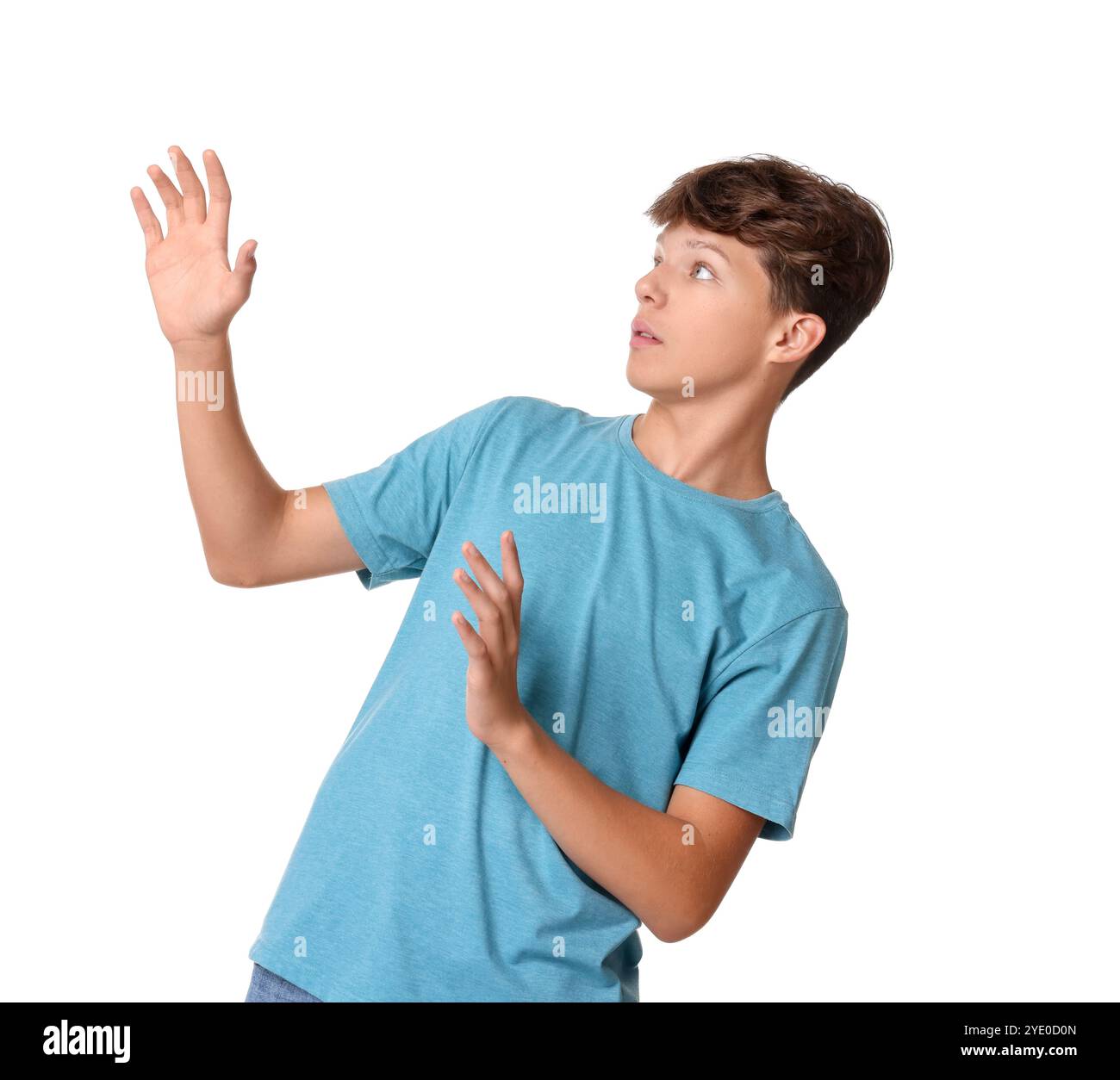 Portrait of scared teenage boy on white background Stock Photo - Alamy