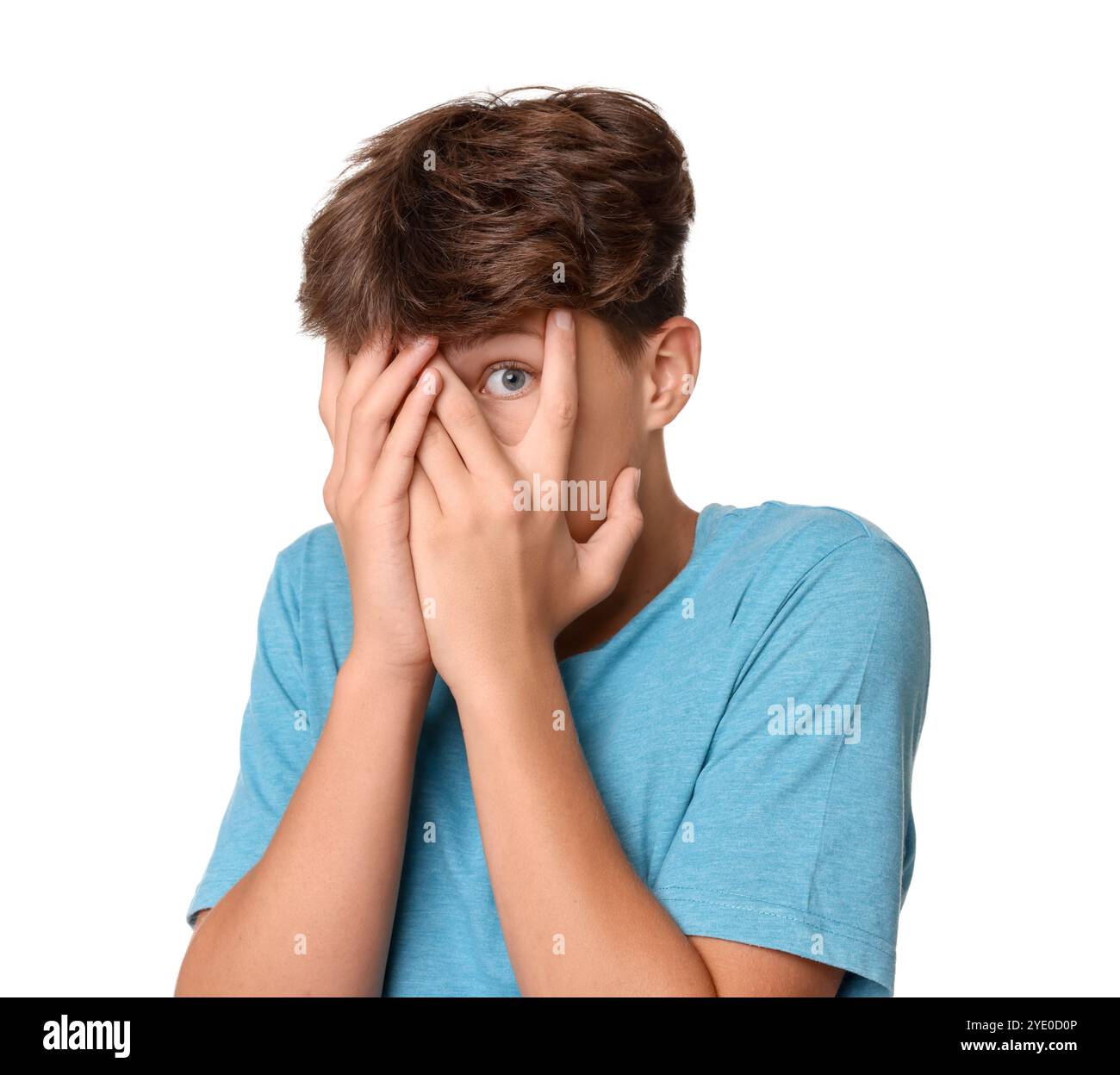 Scared teenage boy covering face with hands on white background Stock ...