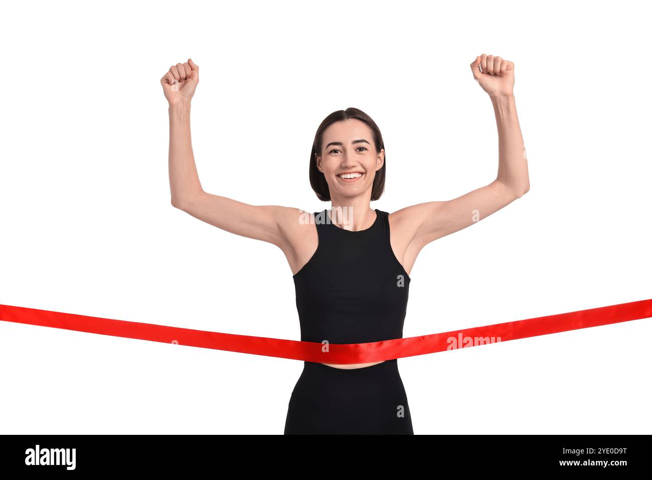 Beautiful woman in sportswear crossing red finish line on white ...
