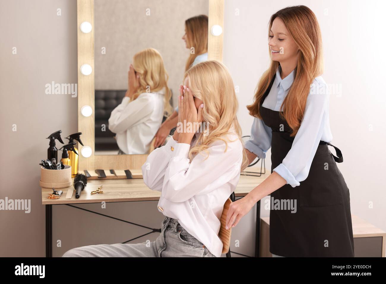 Hair cutting. Professional hairdresser working with client in salon ...