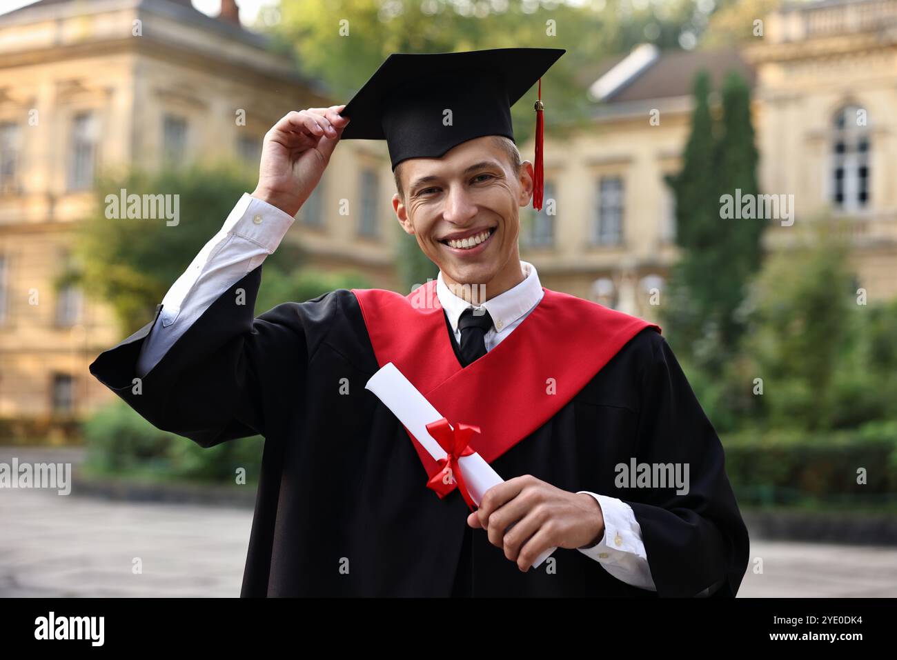 Happy student with diploma after graduation ceremony outdoors Stock ...