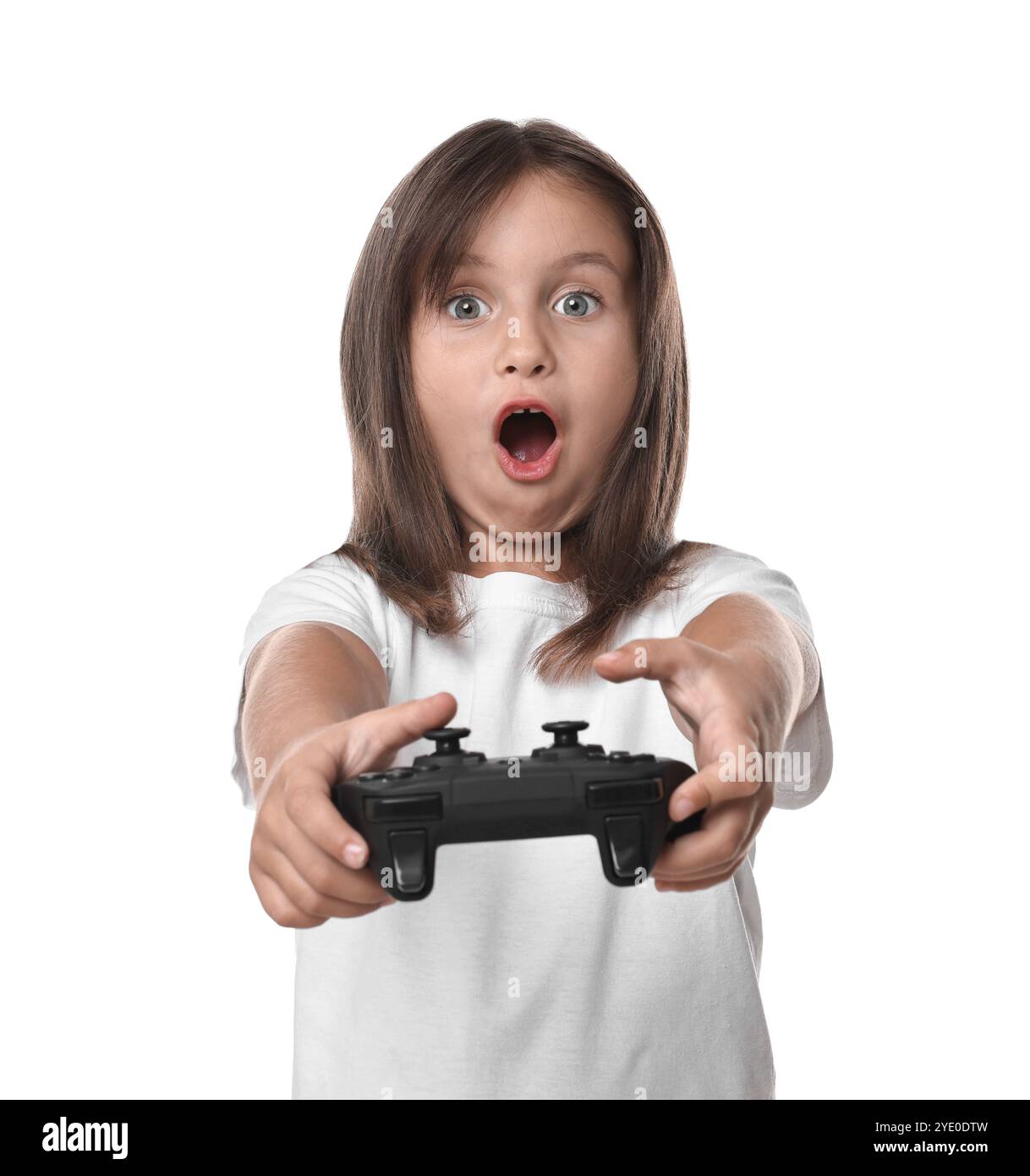 Cute little girl playing video game with controller on white background ...
