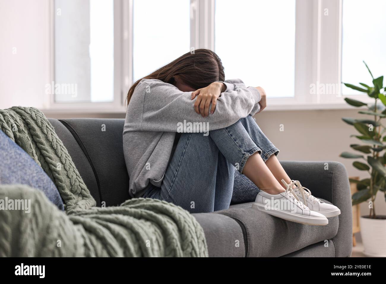 Loneliness concept. Sad teenage girl on sofa at home Stock Photo - Alamy