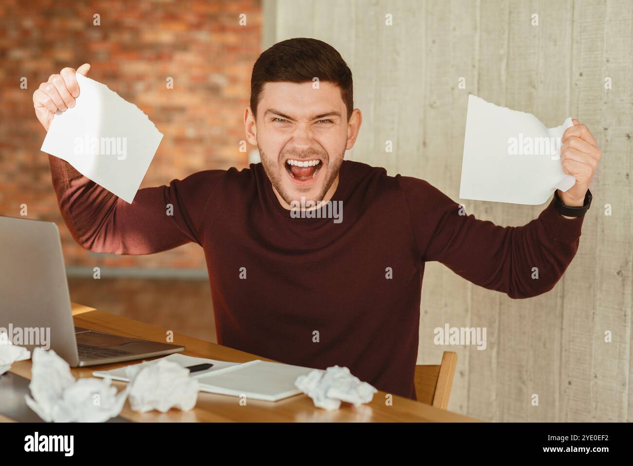 Emotional Office Worker Screaming Crumpling Paper At Workplace Indoor ...