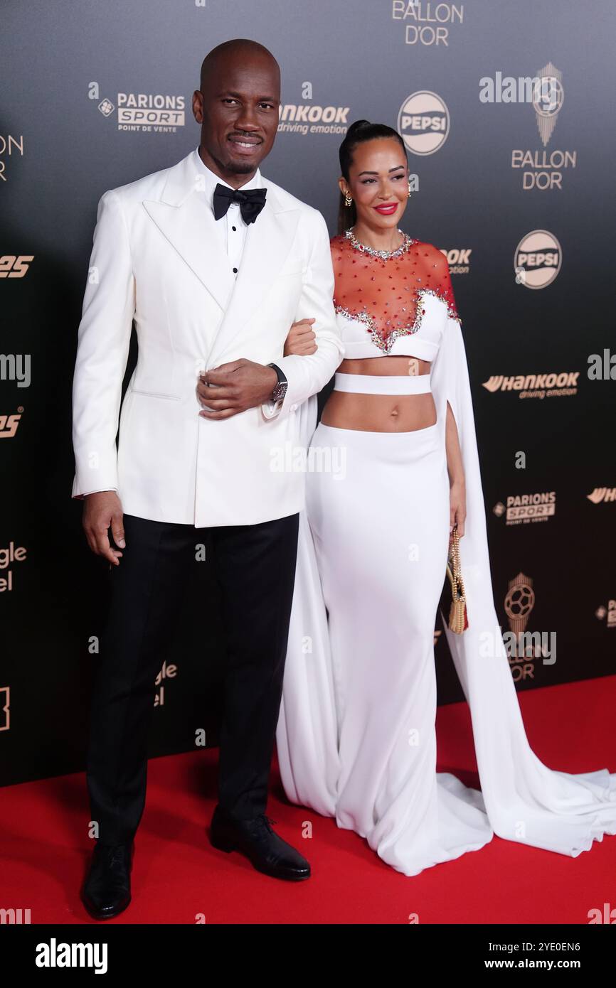 Former player Didier Drogba and partner Gabrielle Lemaire on the red ...