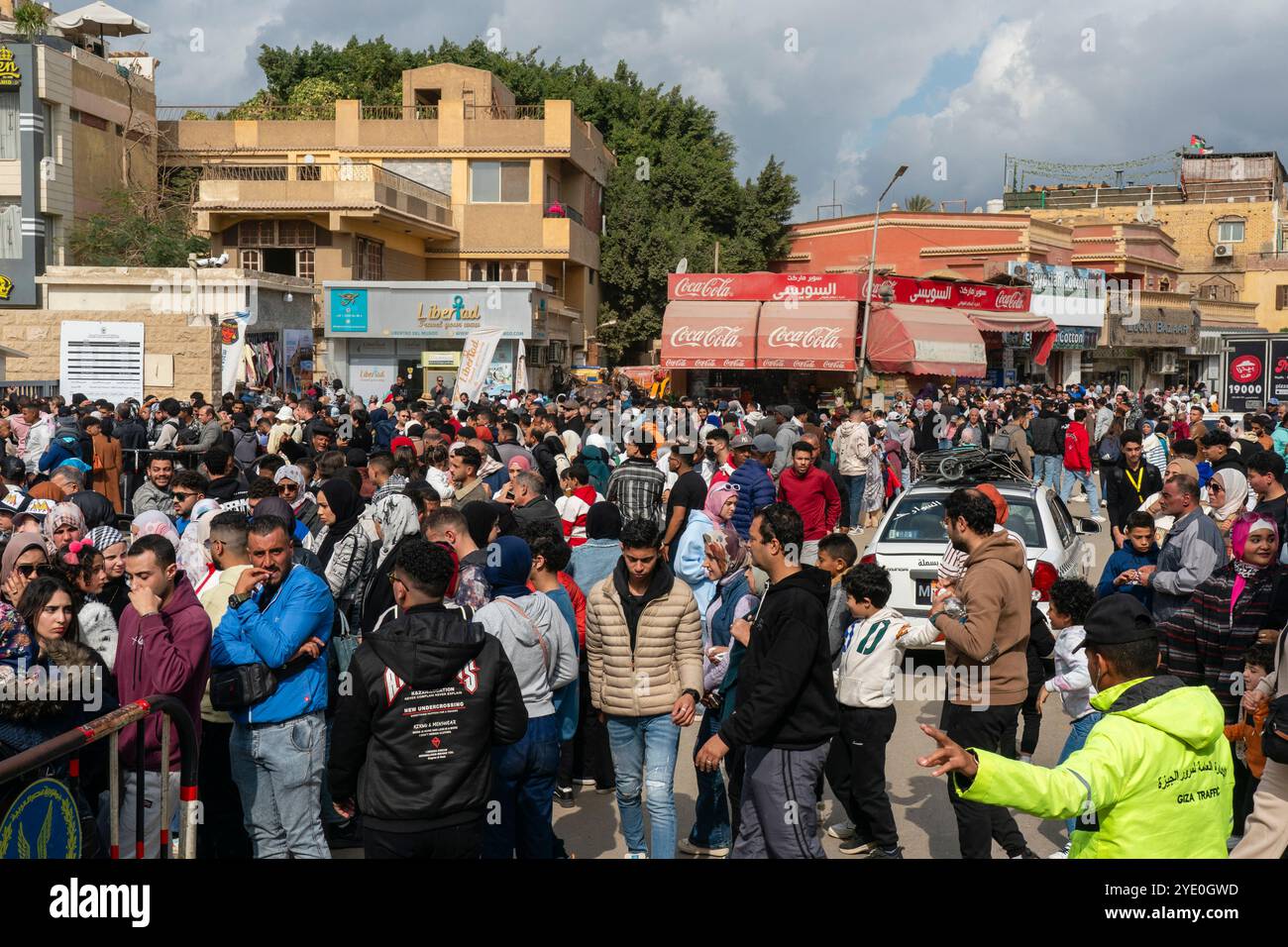 Local tourists queuing at the entrance to the Great Pyramids complex ...