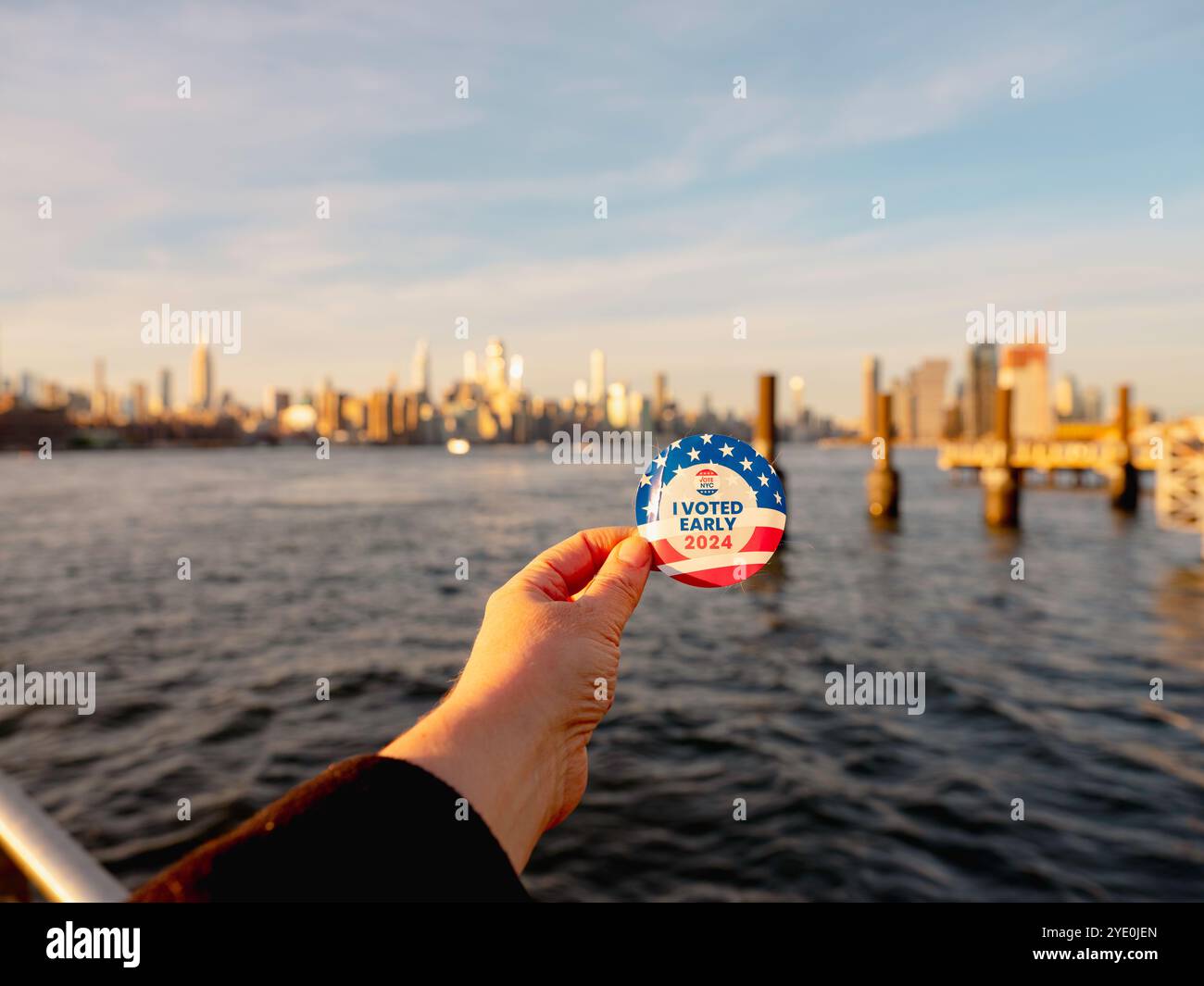 Close up of hand with "I voted Early" sticker - Concept of Early voting ...