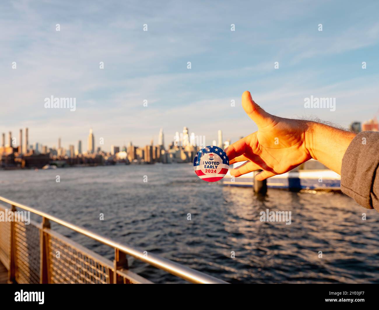 Close up of hand with "I voted Early" sticker - Concept of Early voting ...