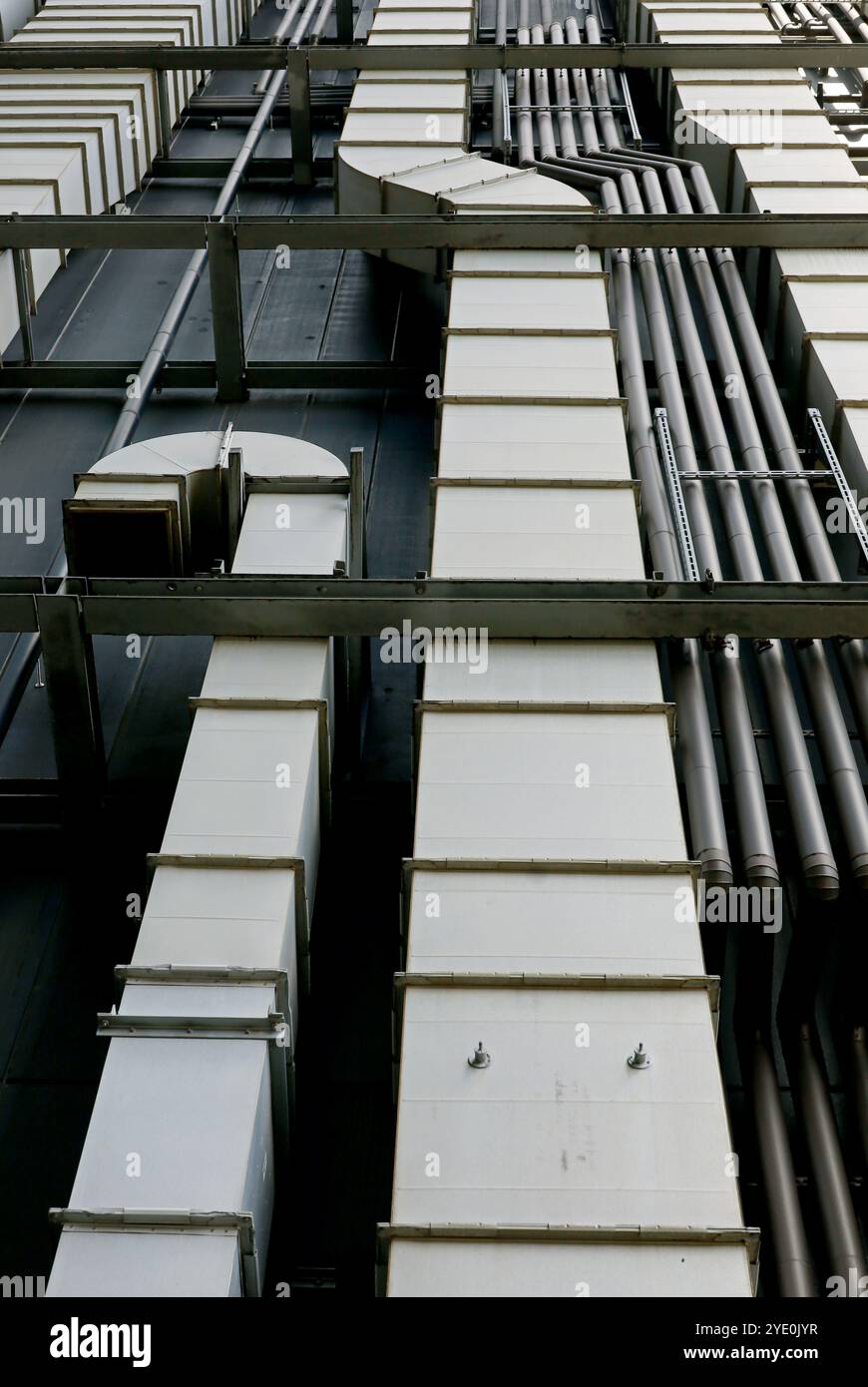 The outside of an artistic building with exhaust ducts and pipes ...