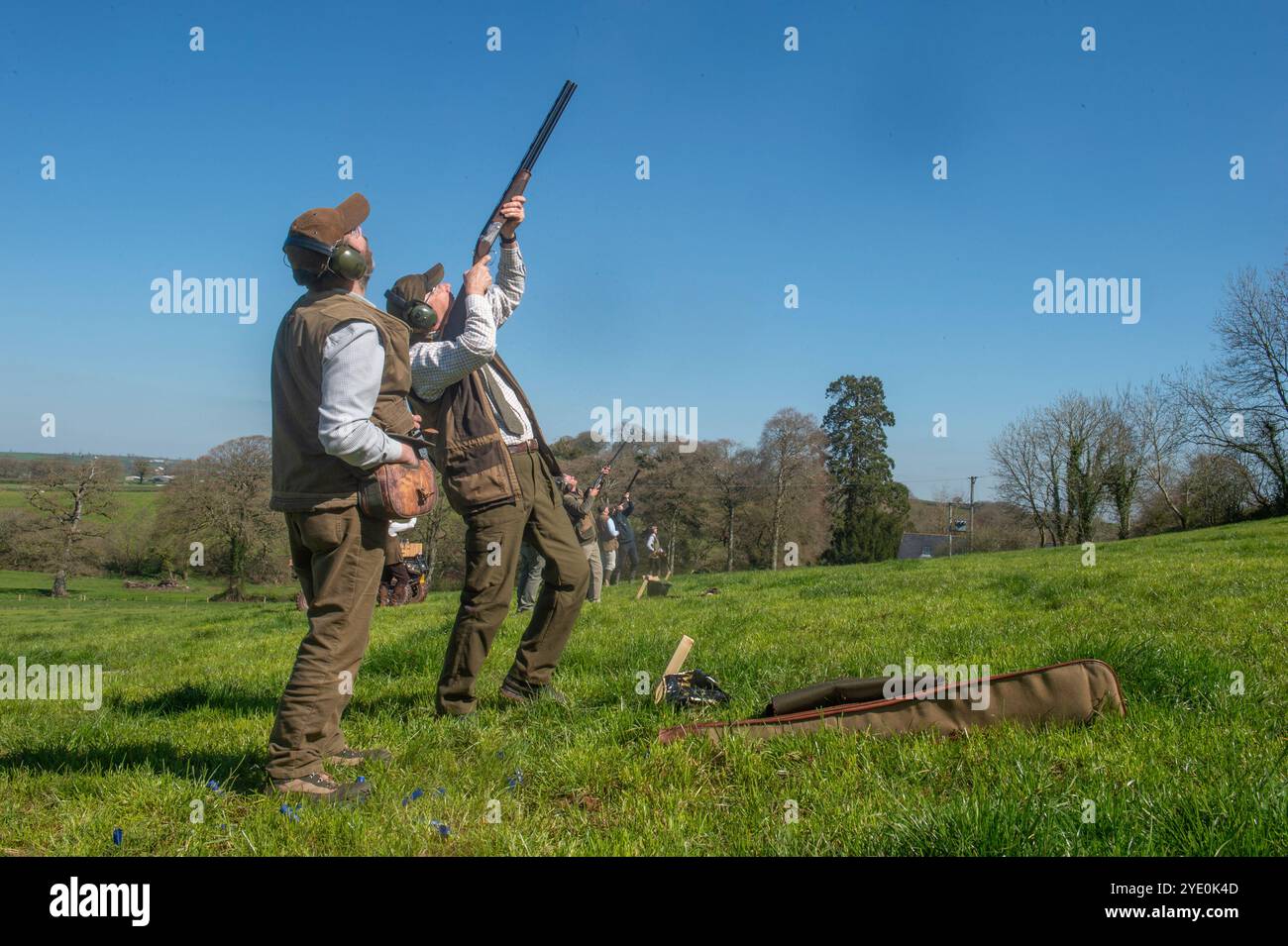 two shooters shooting clay pigeons Stock Photo - Alamy