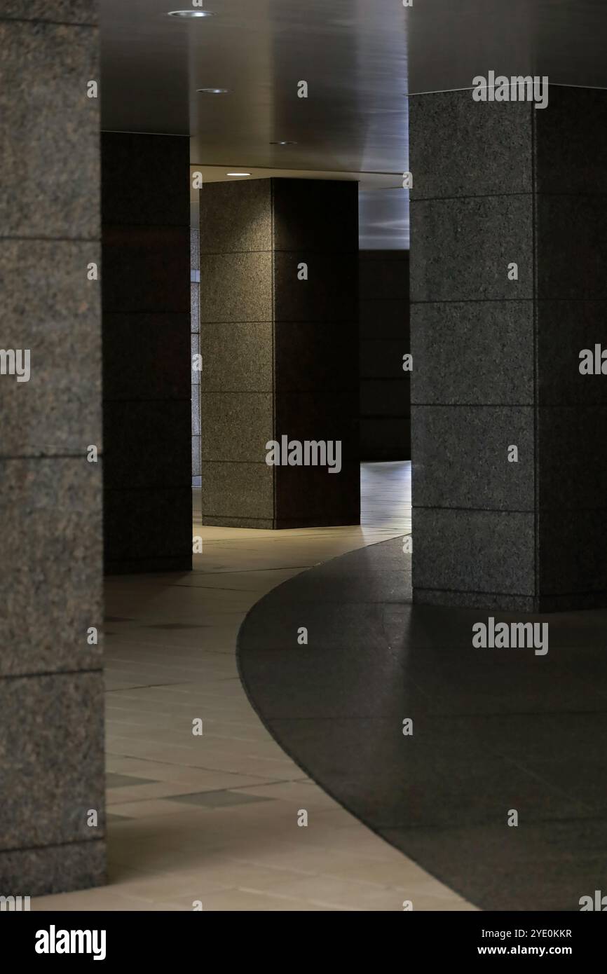 Colonnade of a contemporary building with concrete columns decorated ...