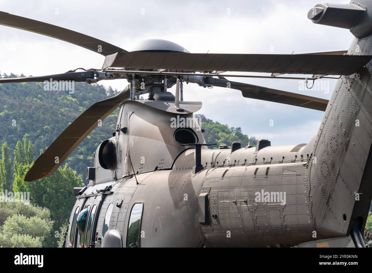 Black painted modern H225 military transport helicopter stationary on ...