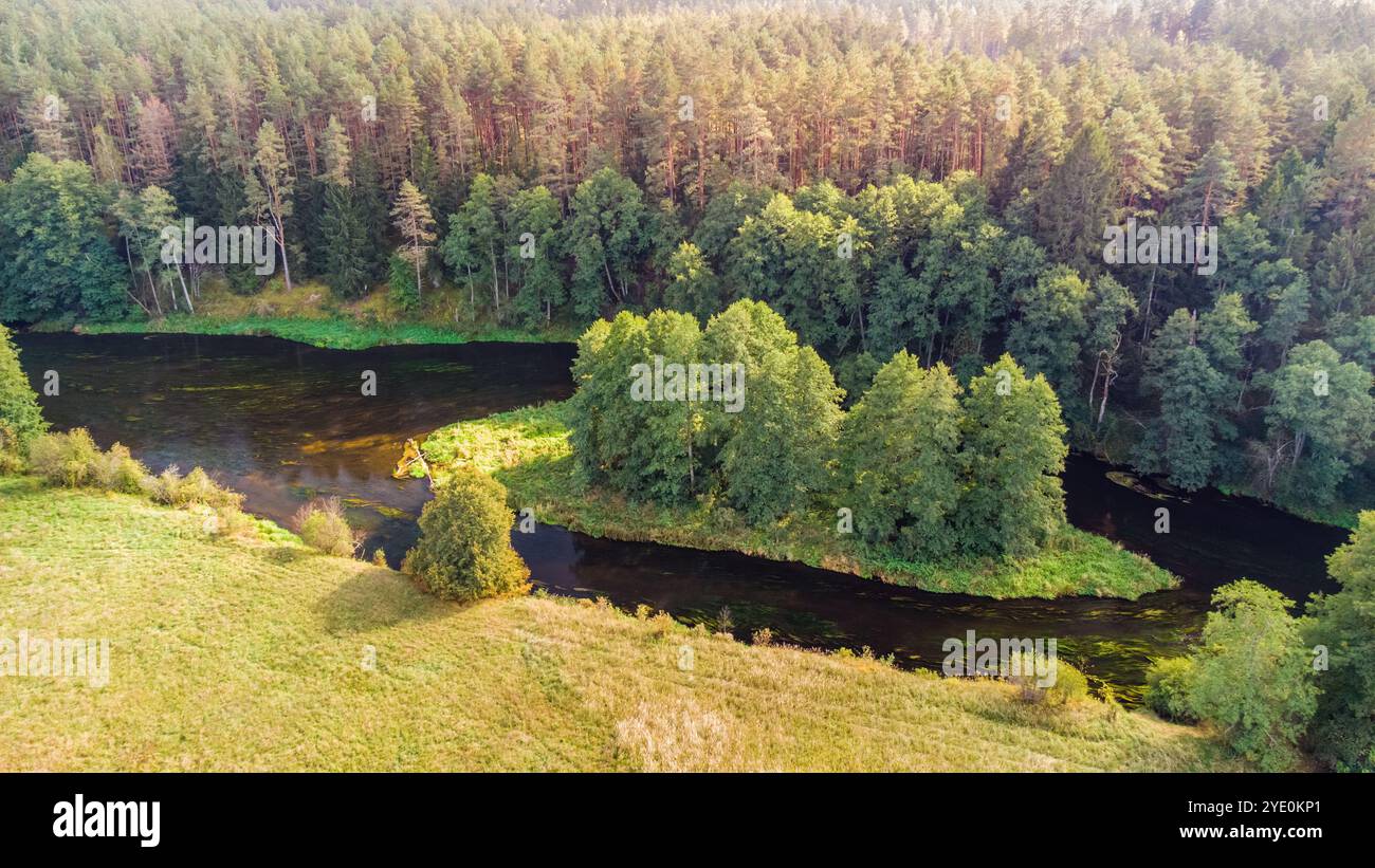 Merkys island of the Lithuanian river, in a wooded environment from ...