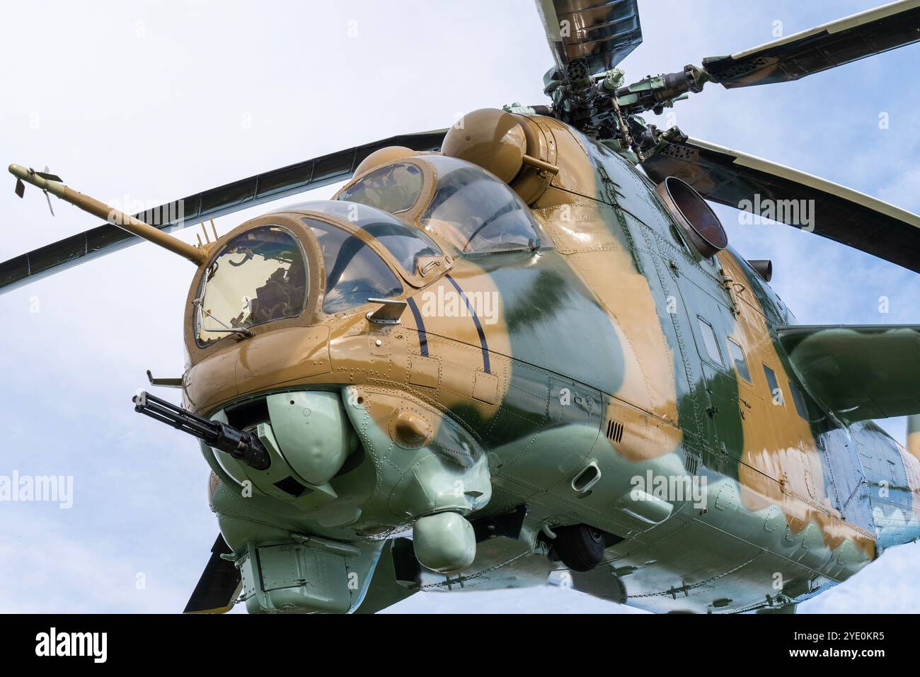 Camouflaged Soviet Mi-24 attack helicopter from below Stock Photo - Alamy
