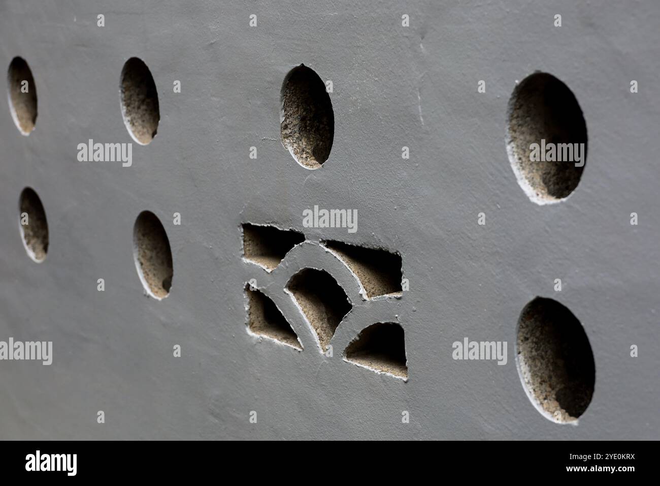 White painted concrete block wall with unique perforated design Stock ...