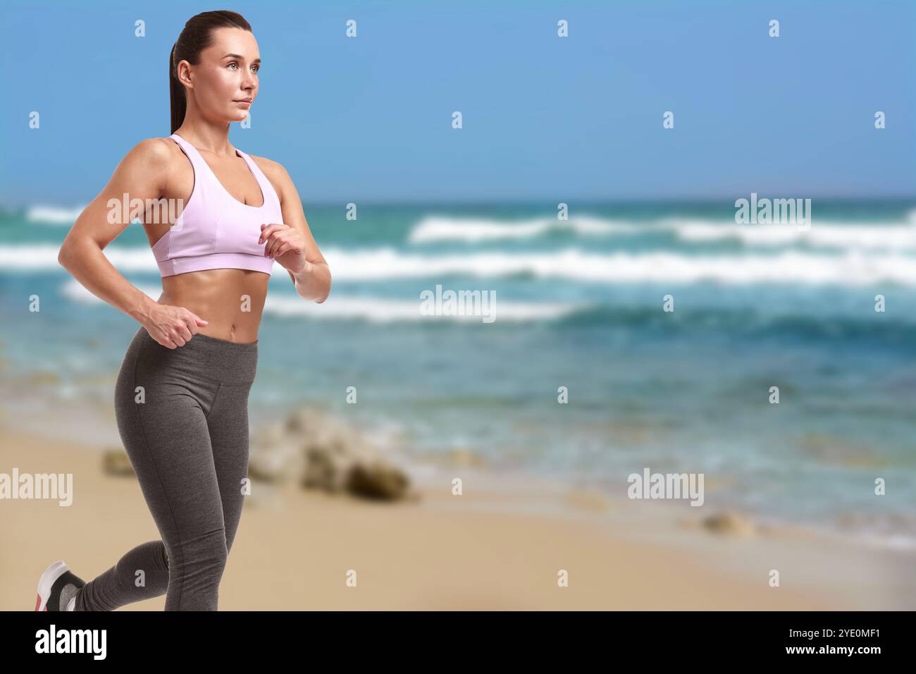 Beautiful woman running on beach. Space for text Stock Photo - Alamy