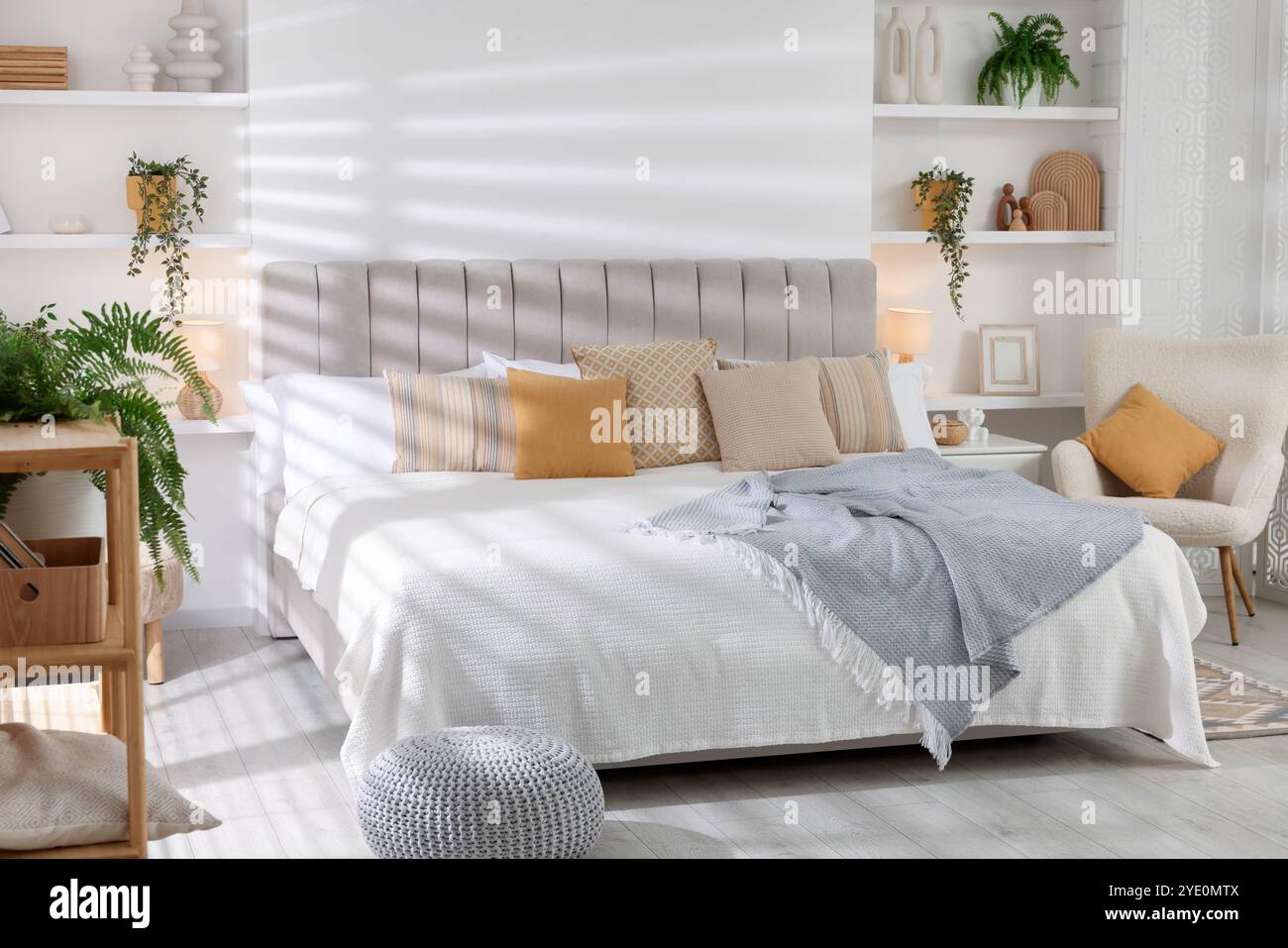 Comfortable large bed in beautiful room. Interior design Stock Photo ...