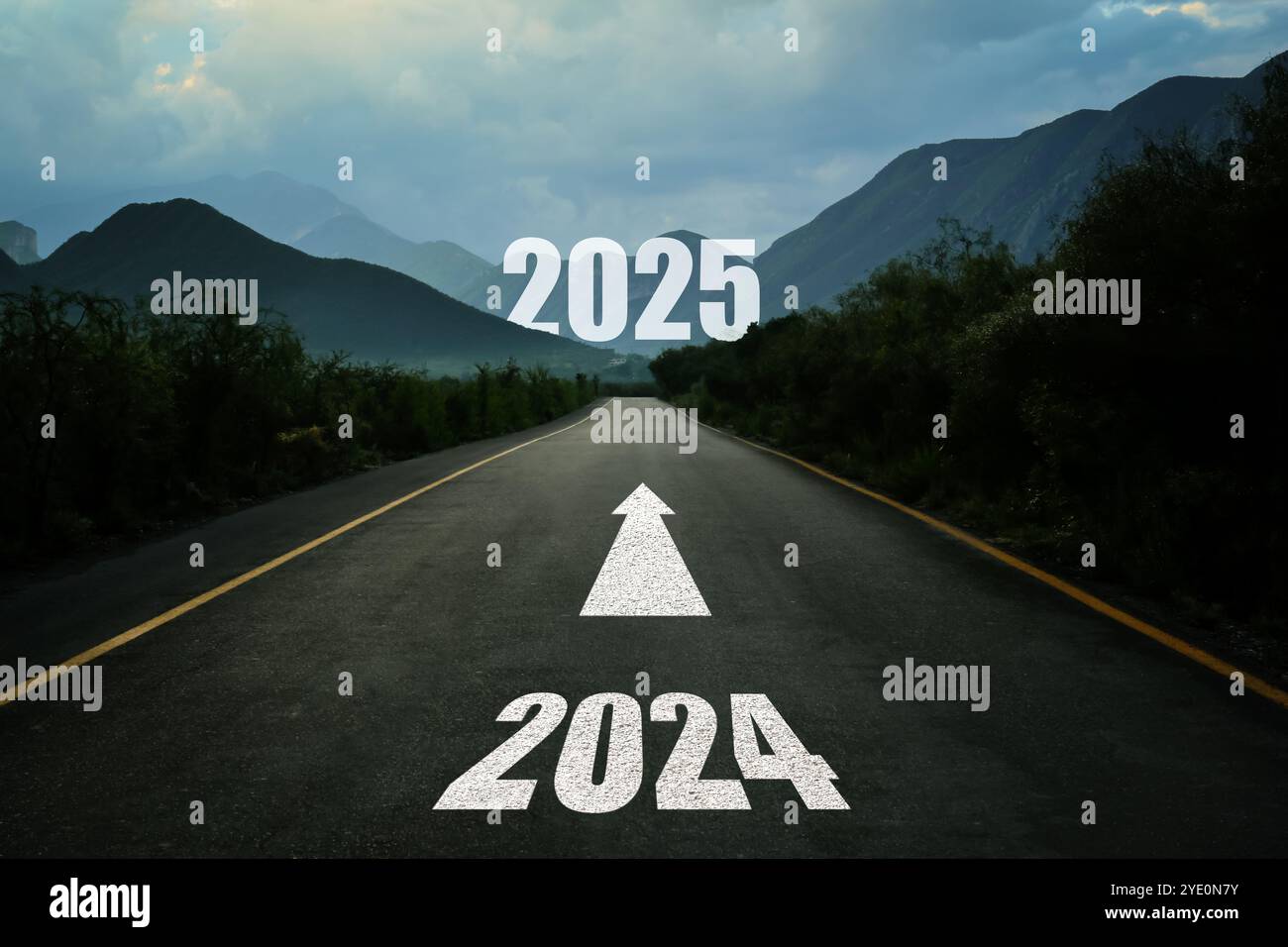 Asphalt road with arrow and 2024 leading to 2025 sign. Concept of new ...