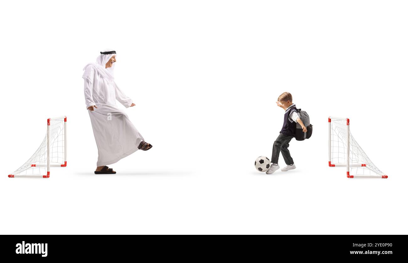 Traditional arab man playing football with a schoolboy isolated on ...
